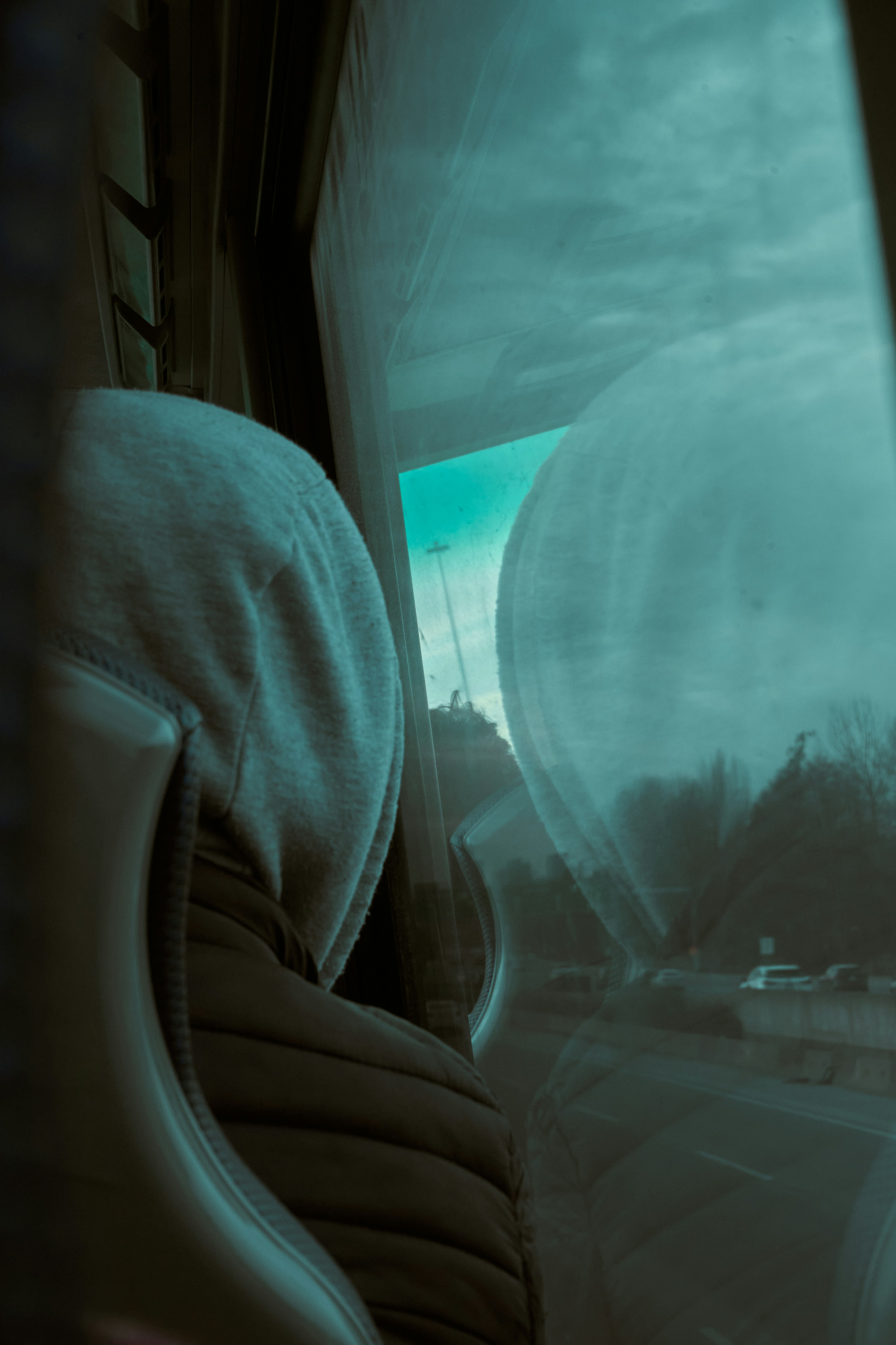Stillness Behind the Window: Portraits in Transit
