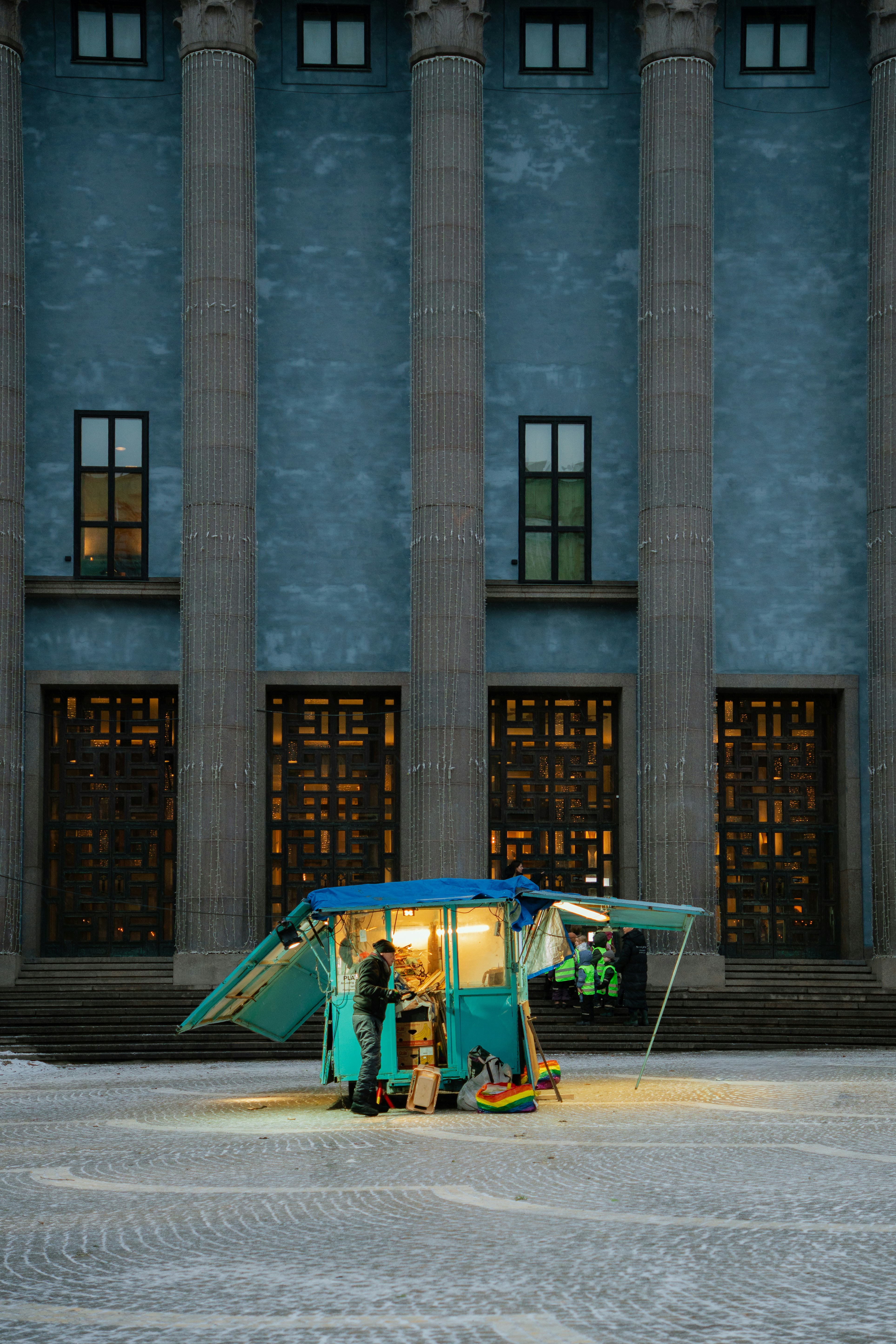 Street-side Teal Canopy: A Quiet Moment Before Dusk