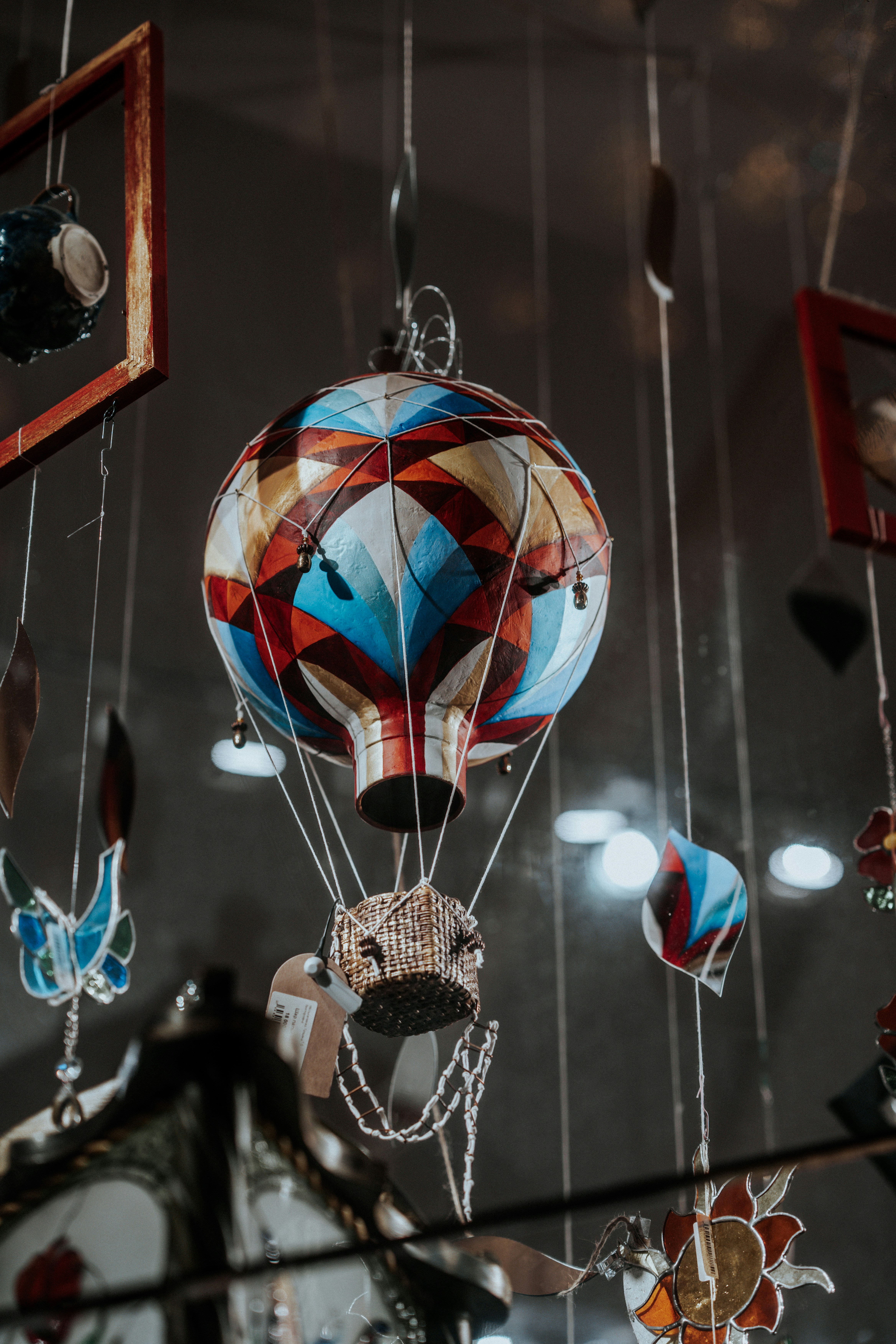 Colorful Hot Air Balloon Ornament Suspended in a Dim Gallery