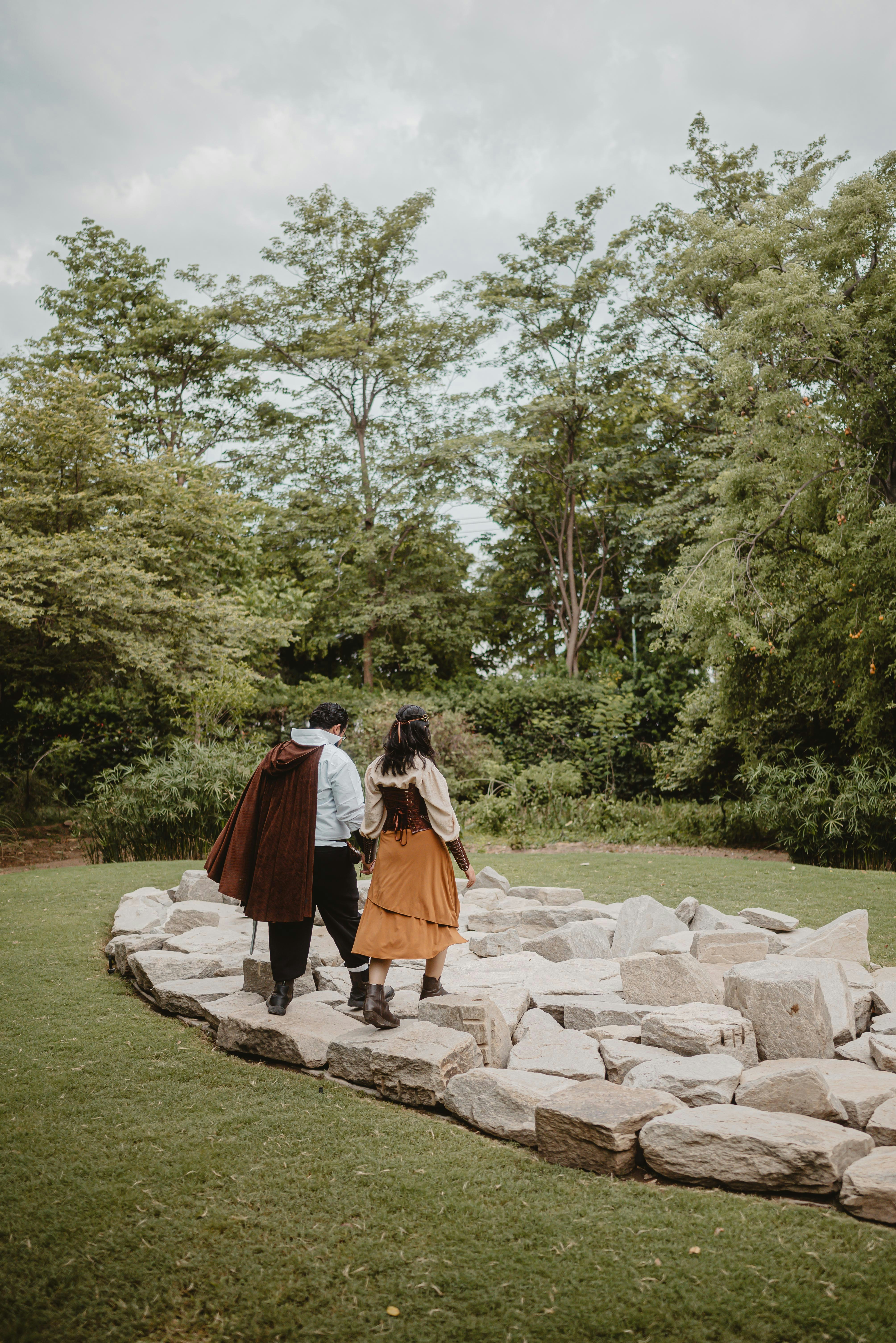 Couple Walking Across a Stone Circle in a Park