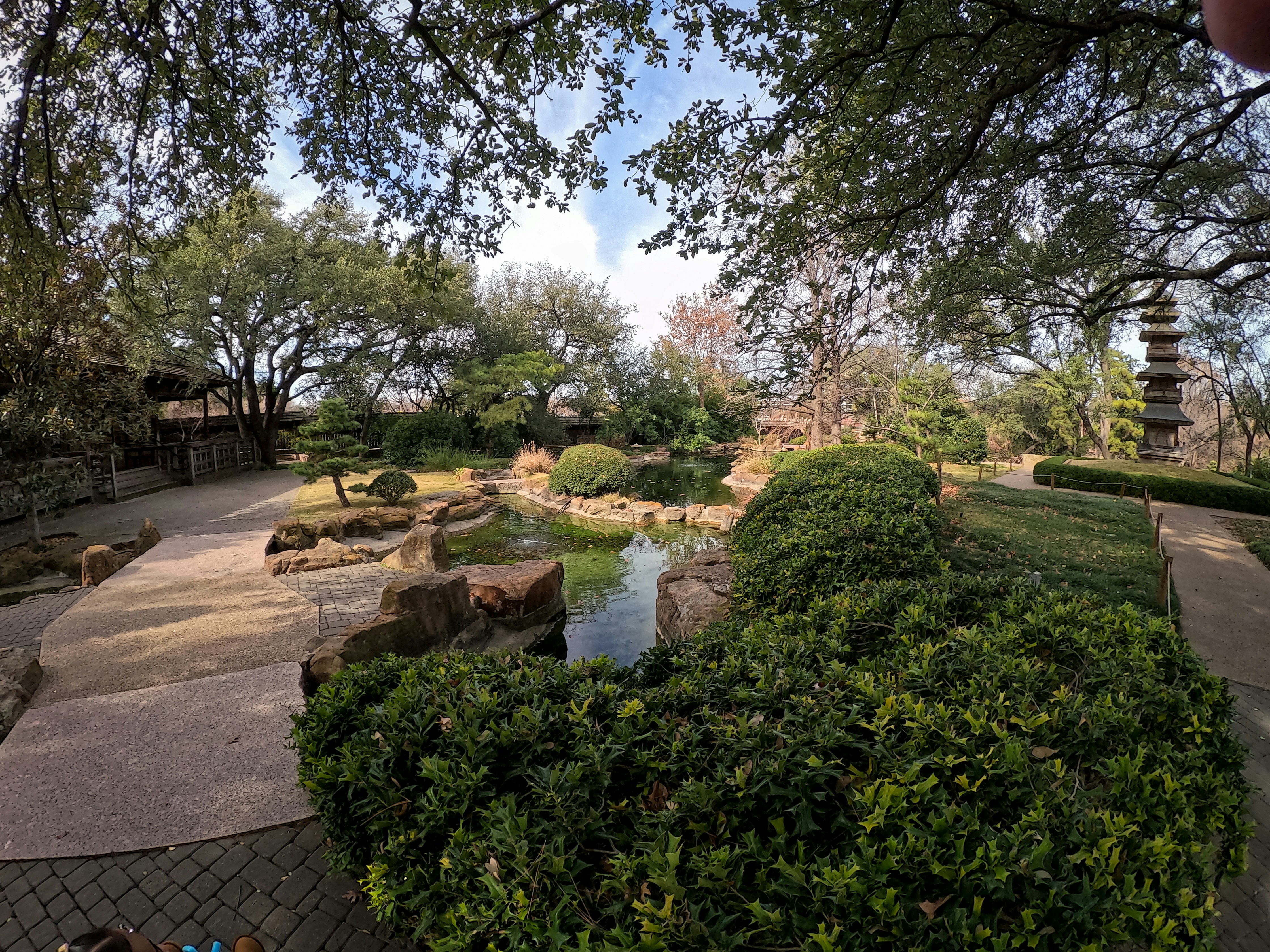 Serene Japanese Garden with Stone Stream and Pagoda Silhouette