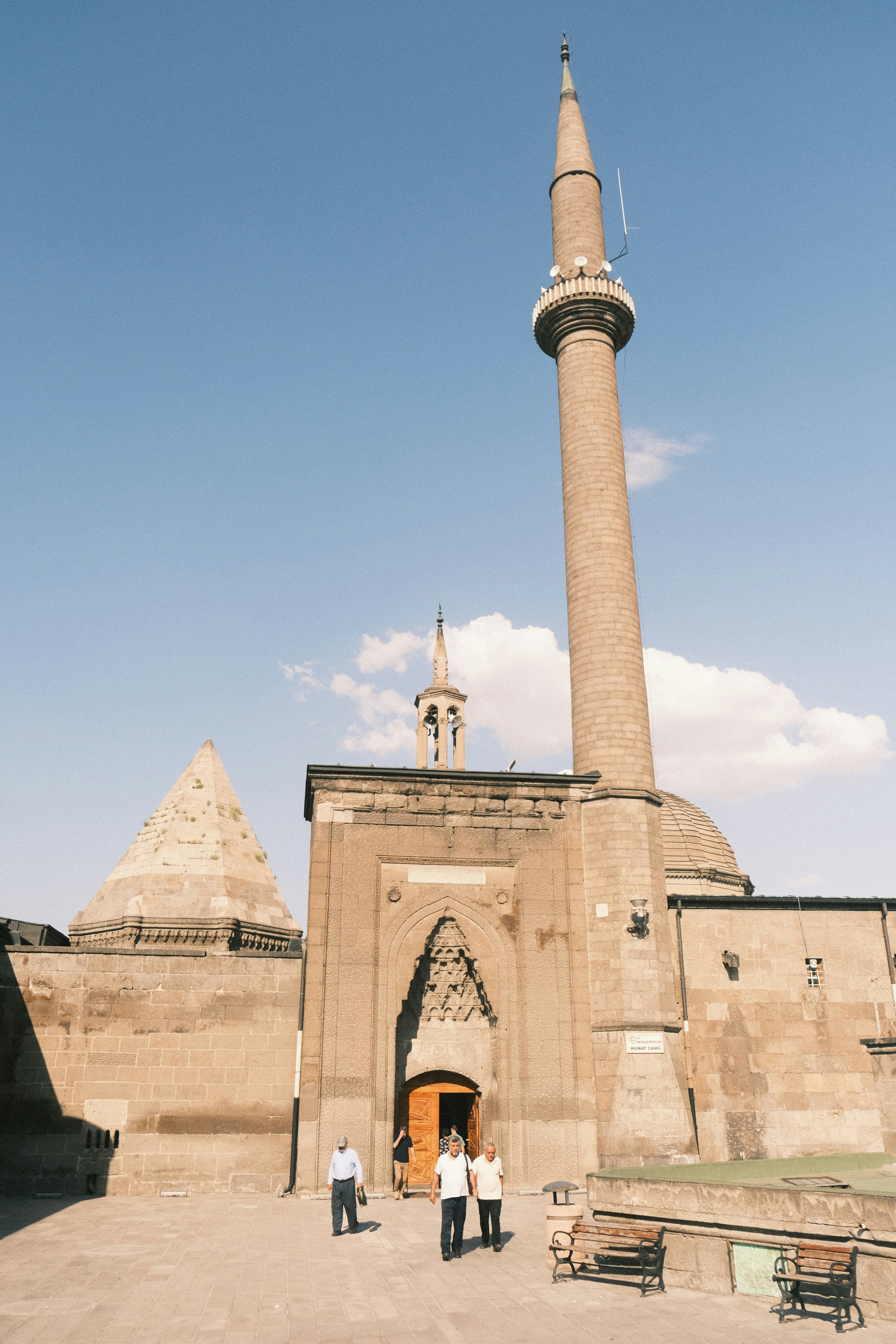 Minaret Above the Historic Gate: Dawn Light on a Stone Mosque Complex