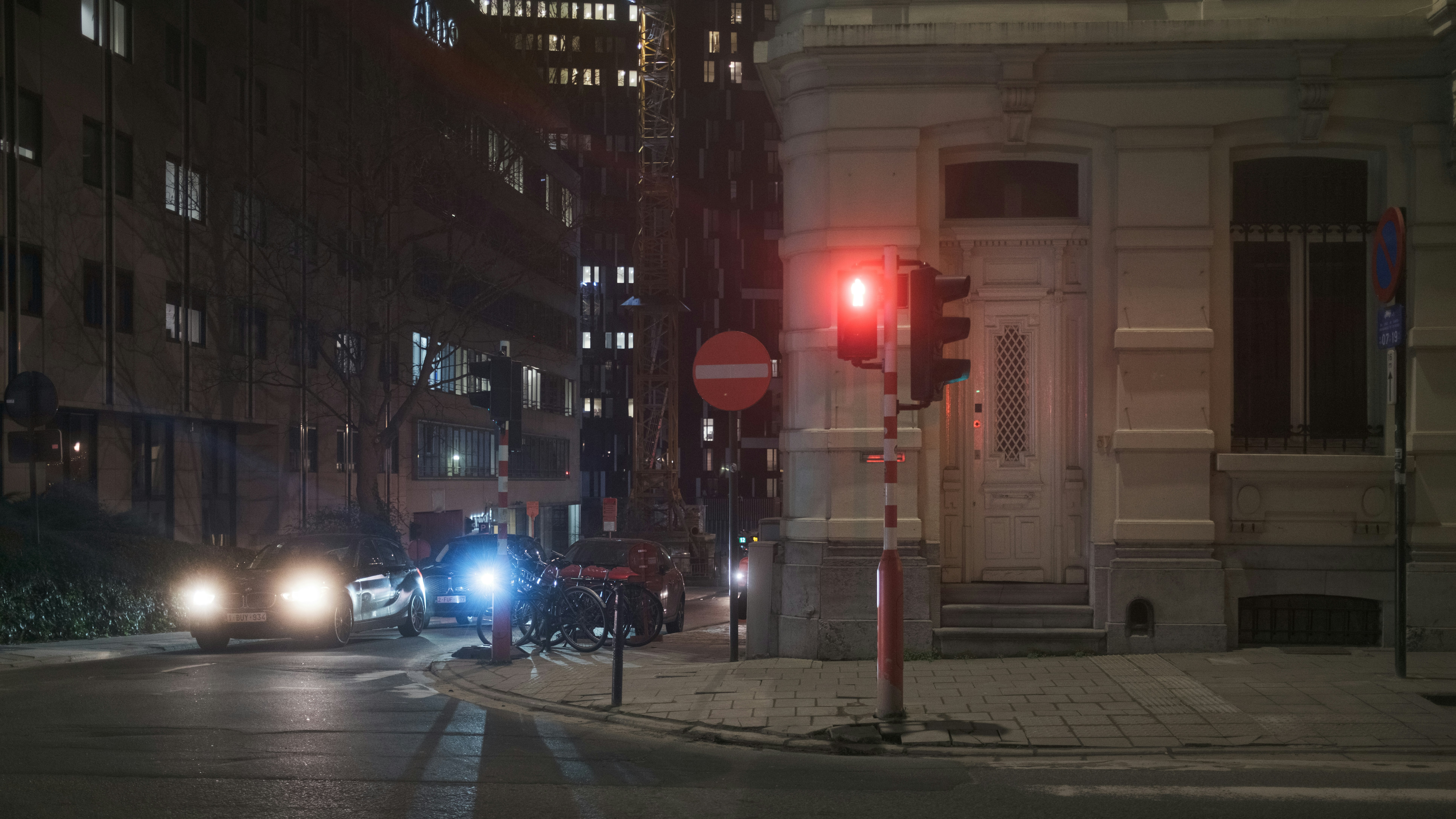 Red Streetlight Vigil: Night Police at the Corner