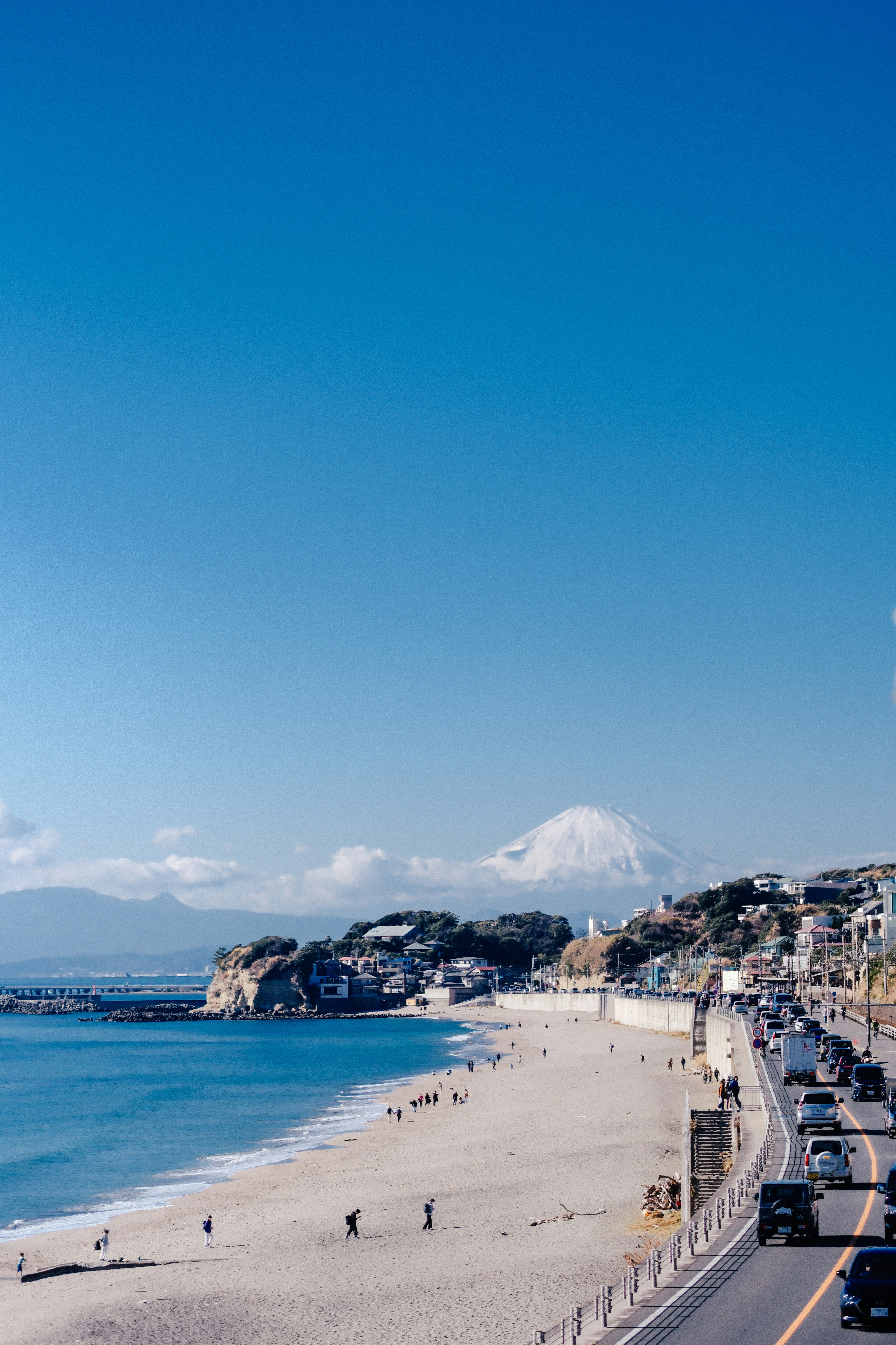 Coastal Roadway Threading the Skyline Toward Mount Fuji