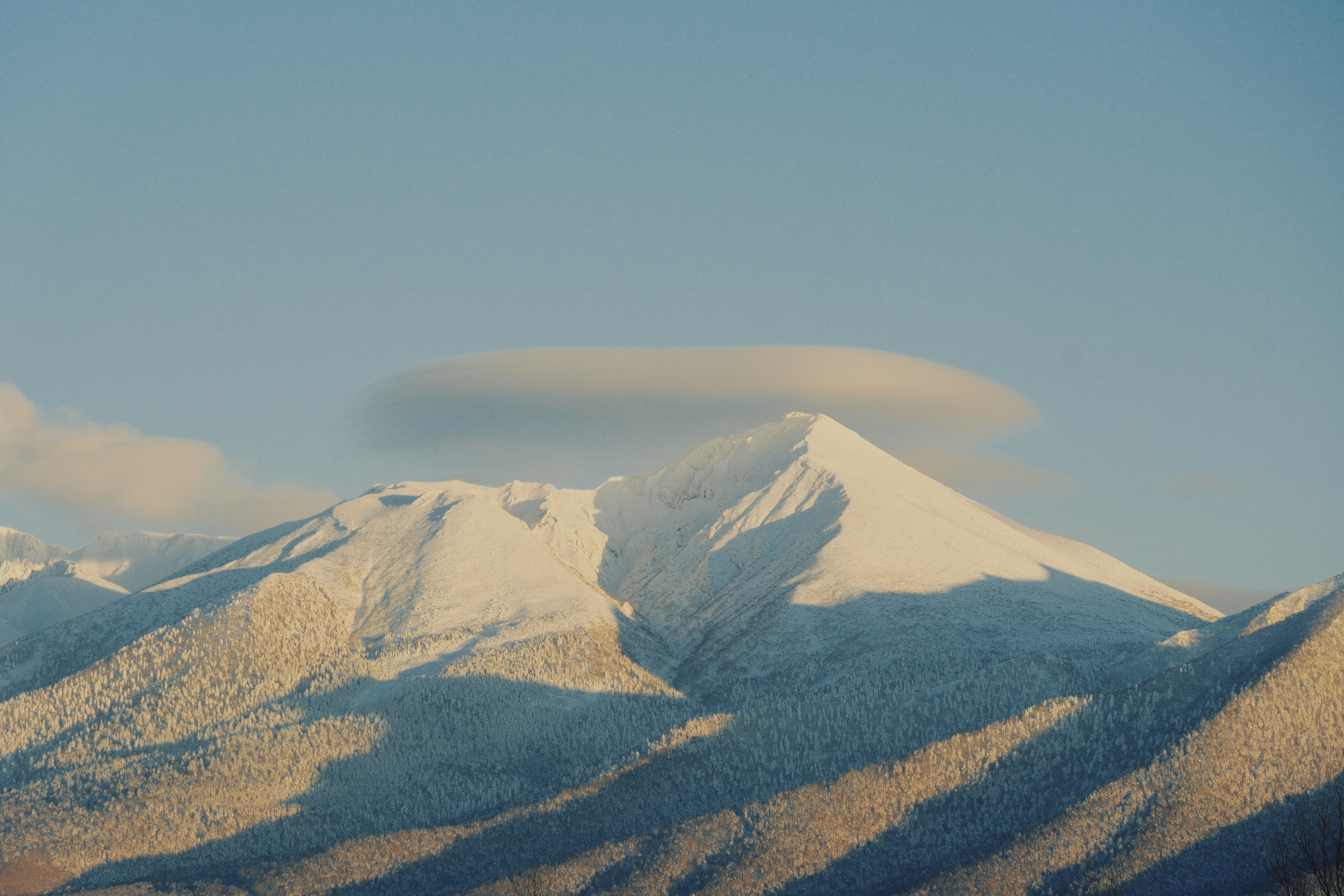 A Quiet Peak Under a Glassy Corona