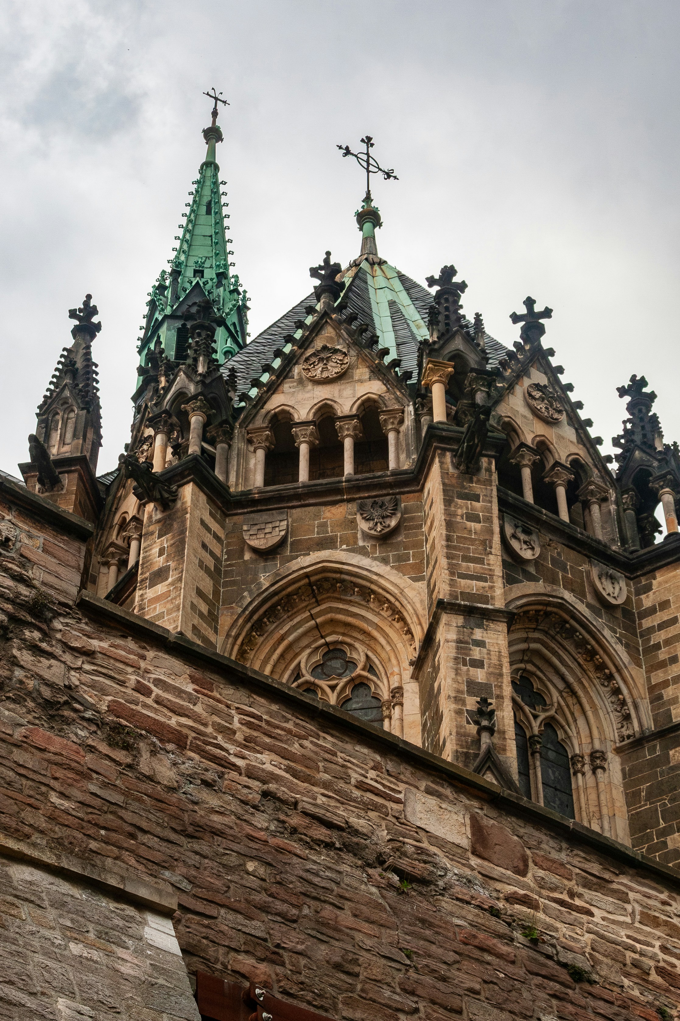 Gothic Cathedral Facade Arches Reach Toward Stormy Skies