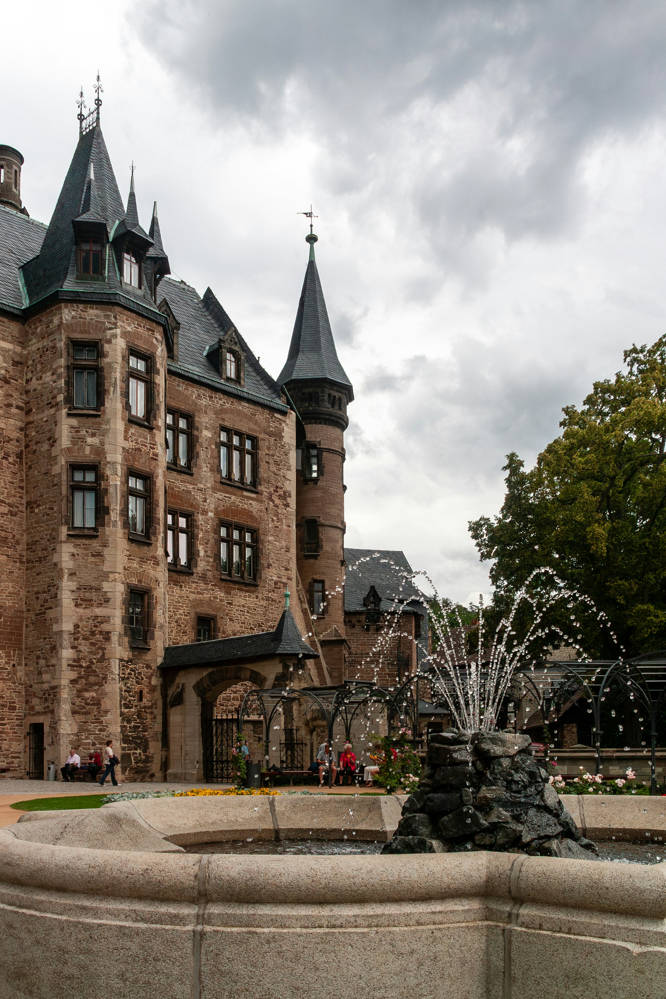 Stone Castle Courtyard with Central Fountain Burst