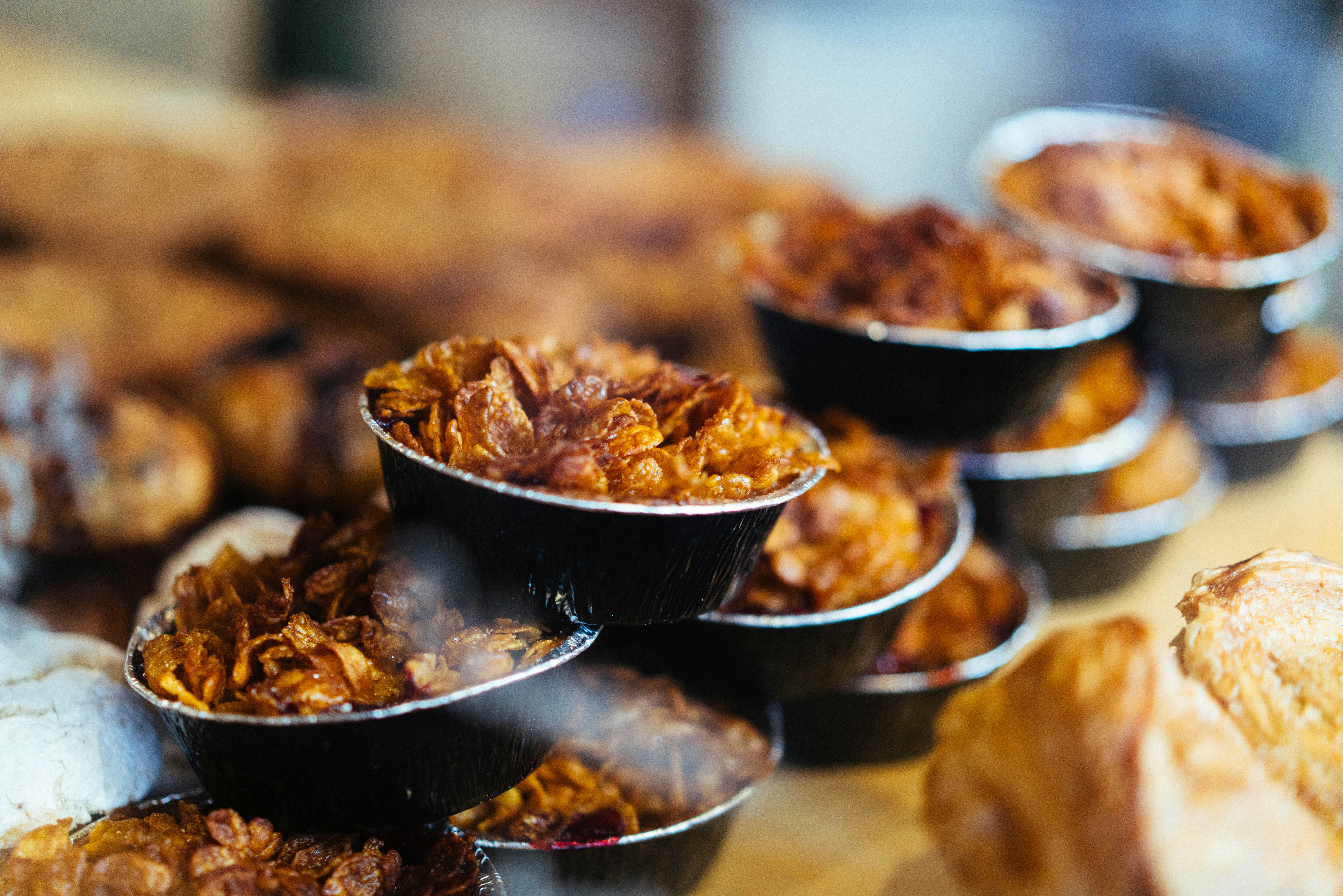 Stacked Caramel Crunch Bites in a Bakery Display