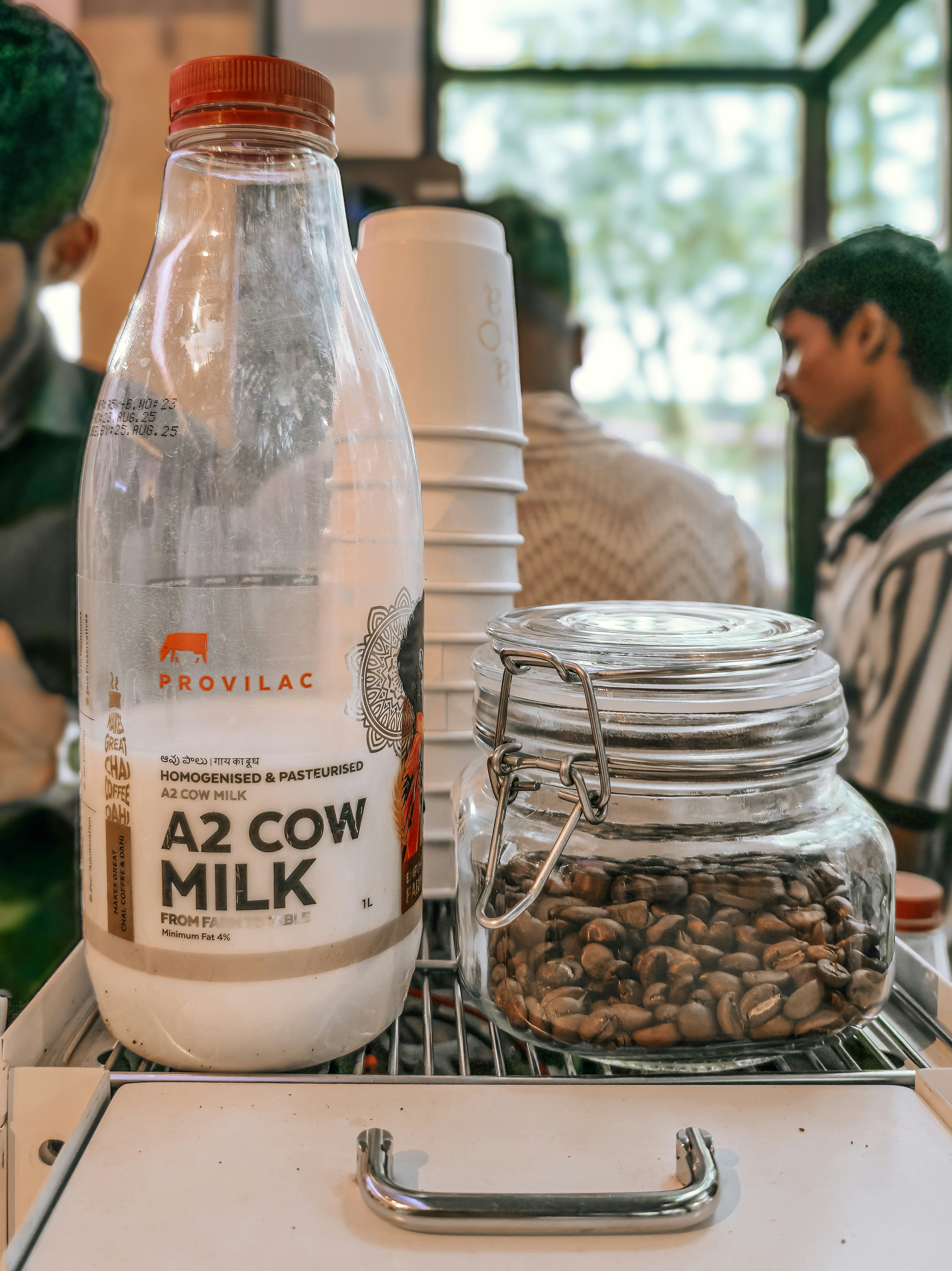 A2 cow milk bottle and coffee beans in a jar. photo – Free Cafe Image ...