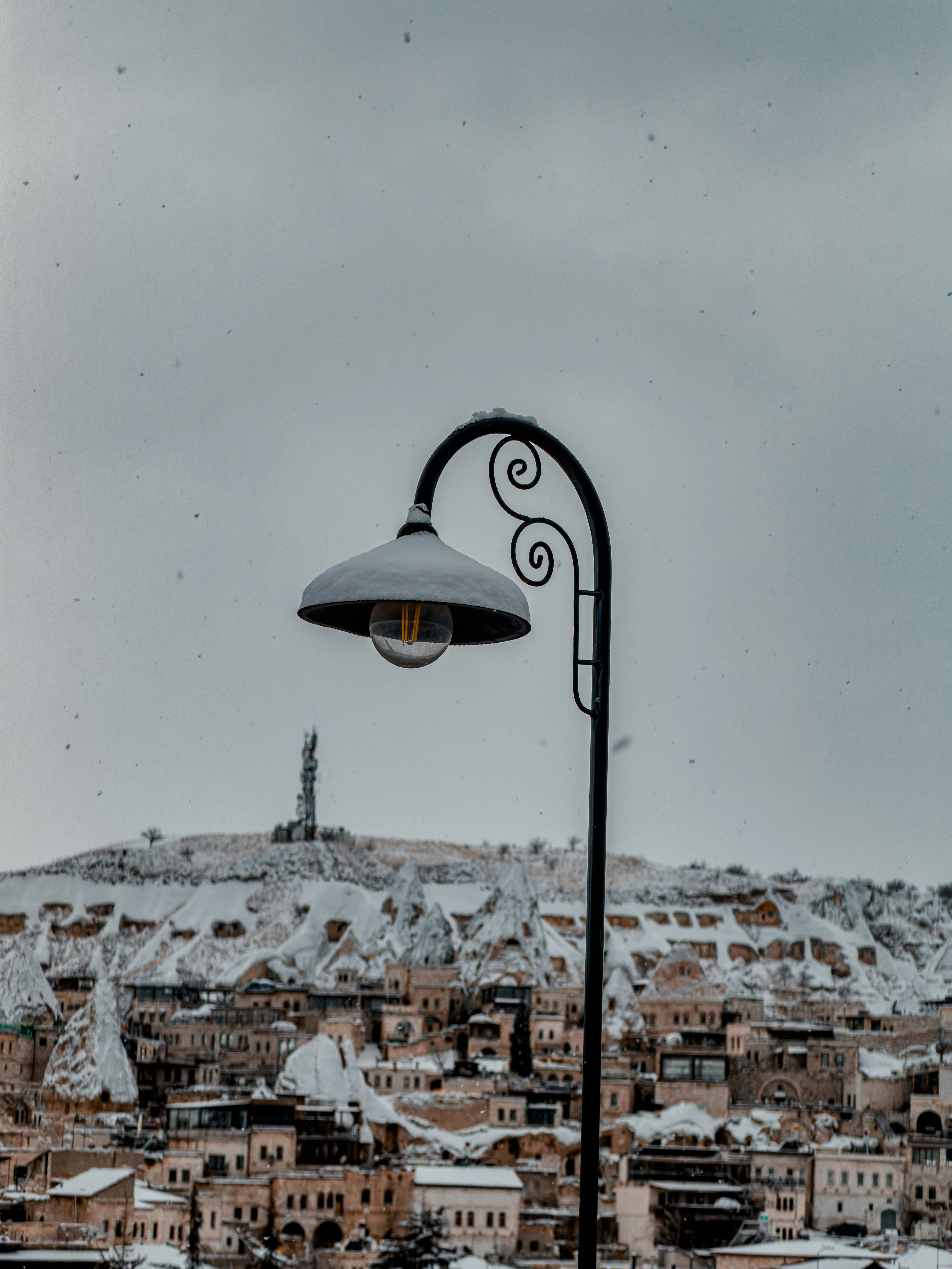 Lonely Streetlamp Over a Snowbound Town