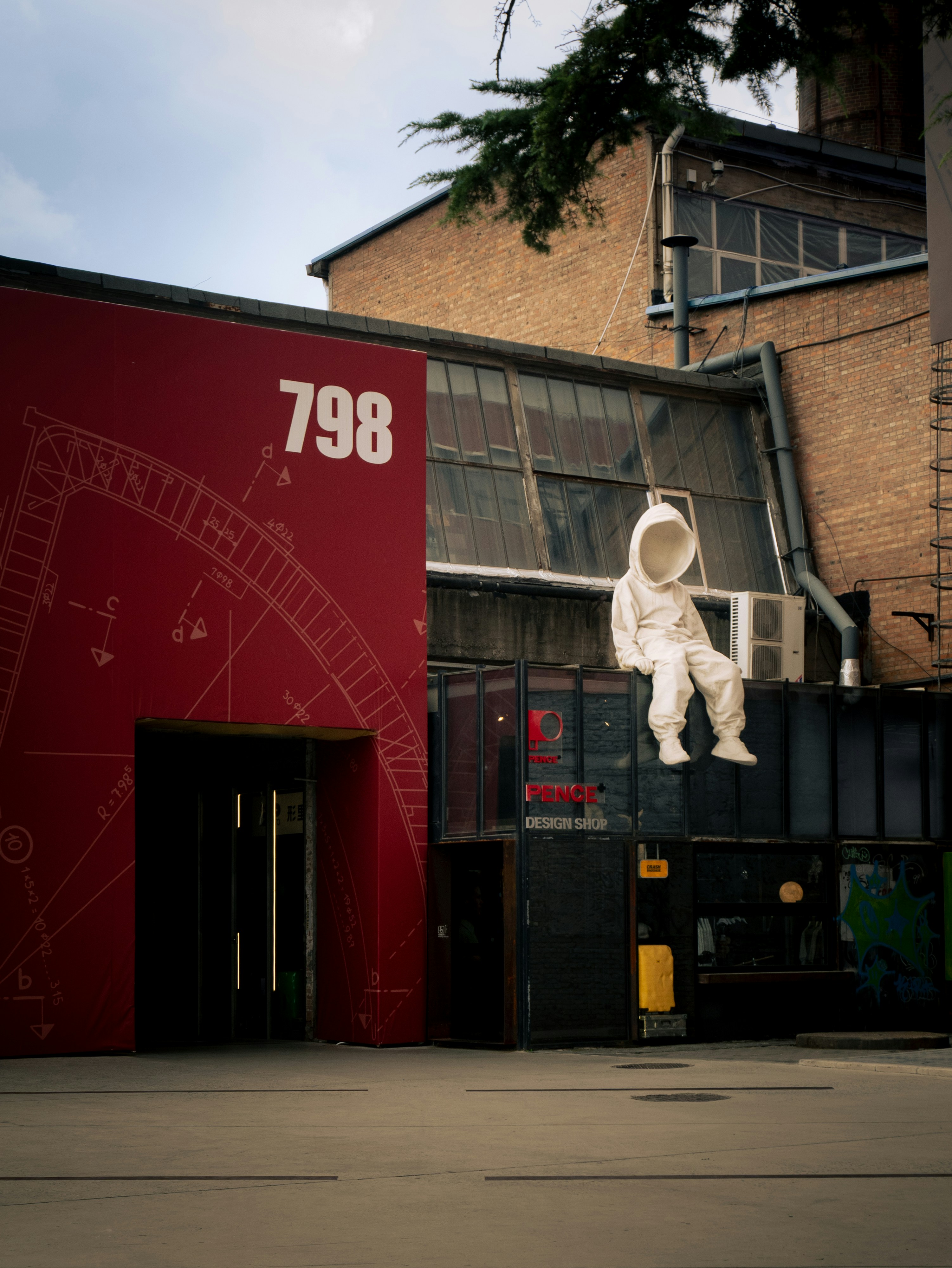 Astronaut Hangs Above an Urban Facade at Doorway Nine Hundred
