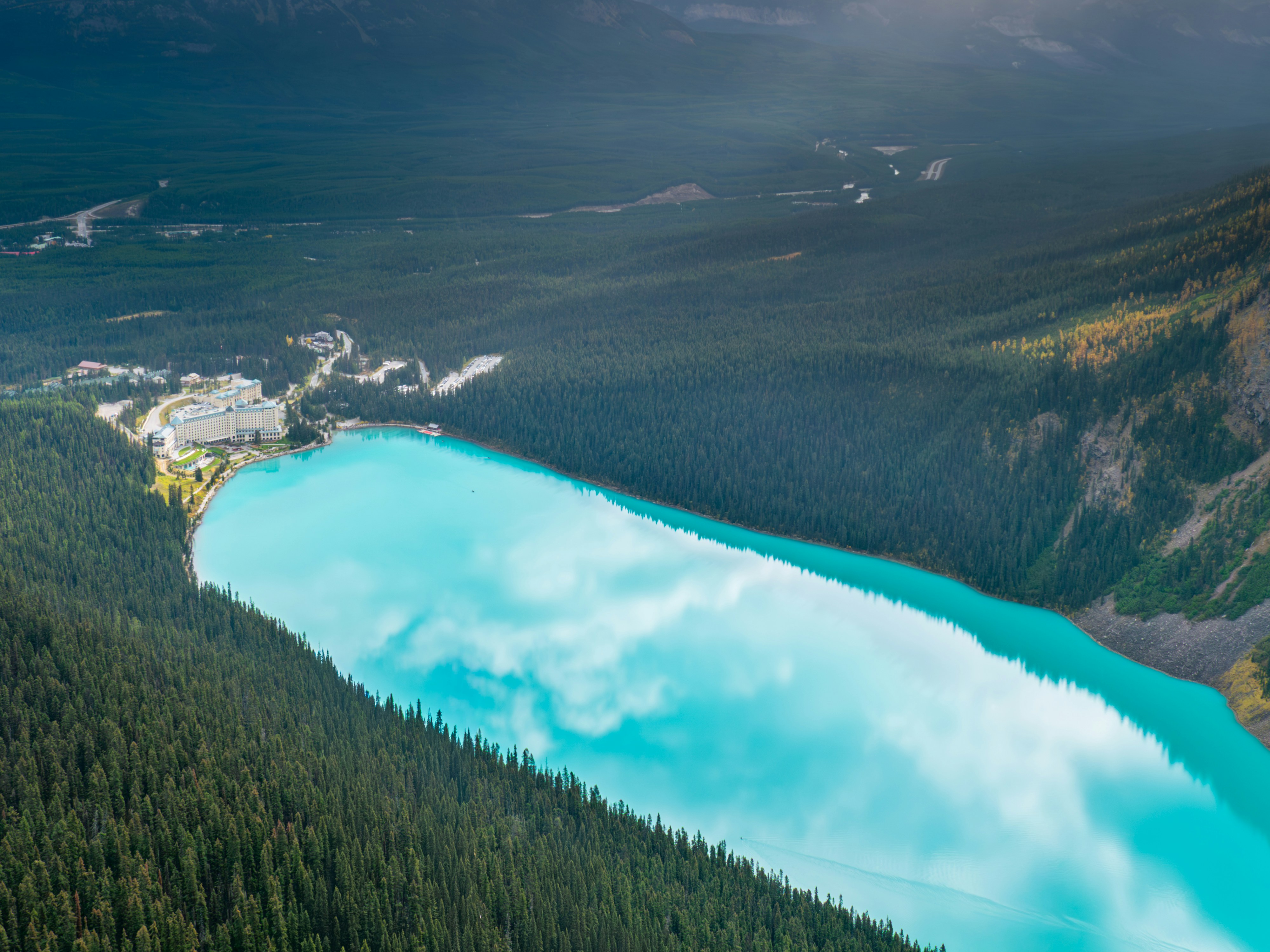 A Turquoise Crater Lake Carved by Sky and Forest