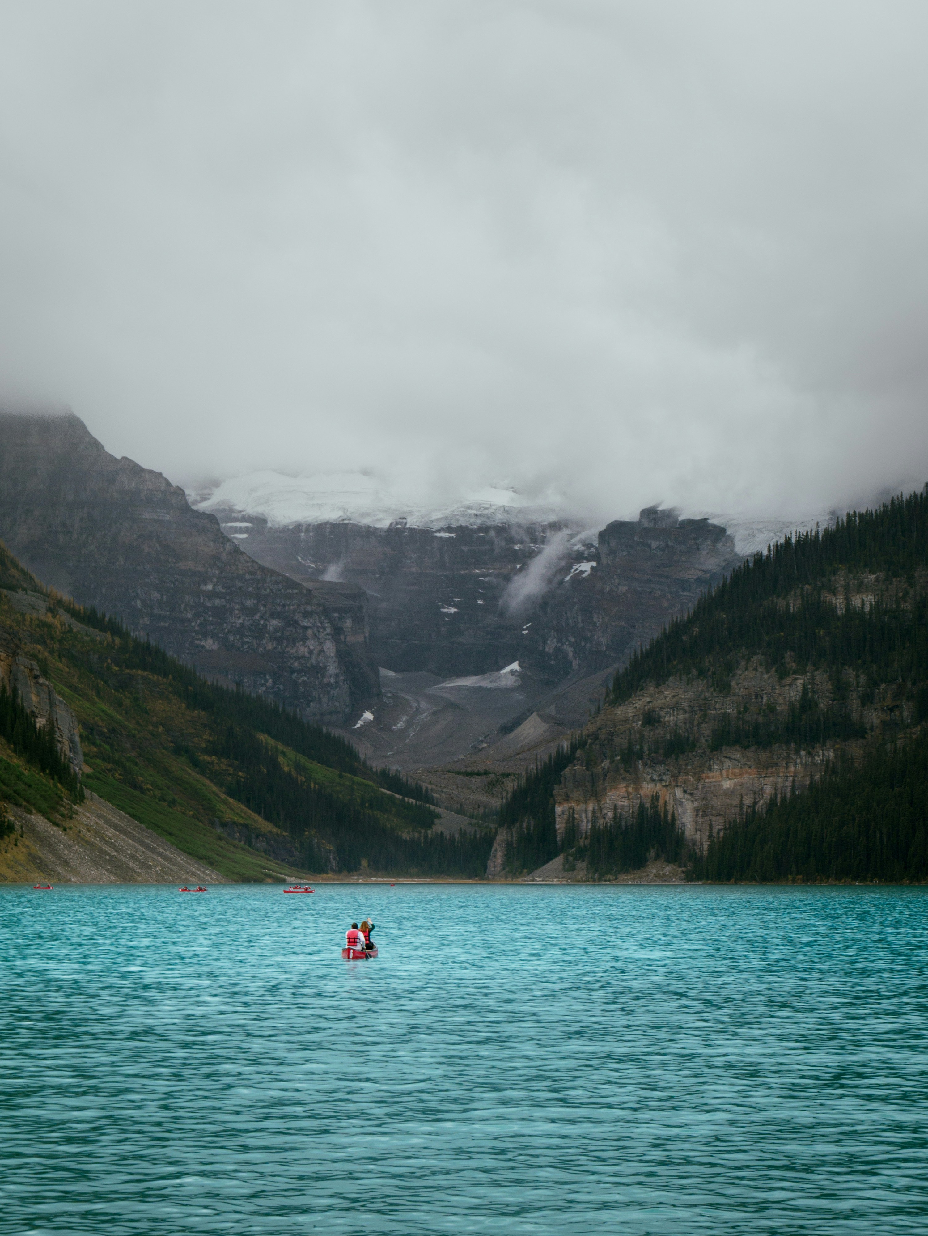 Emerald Lake Surrounded by Misty Peaks