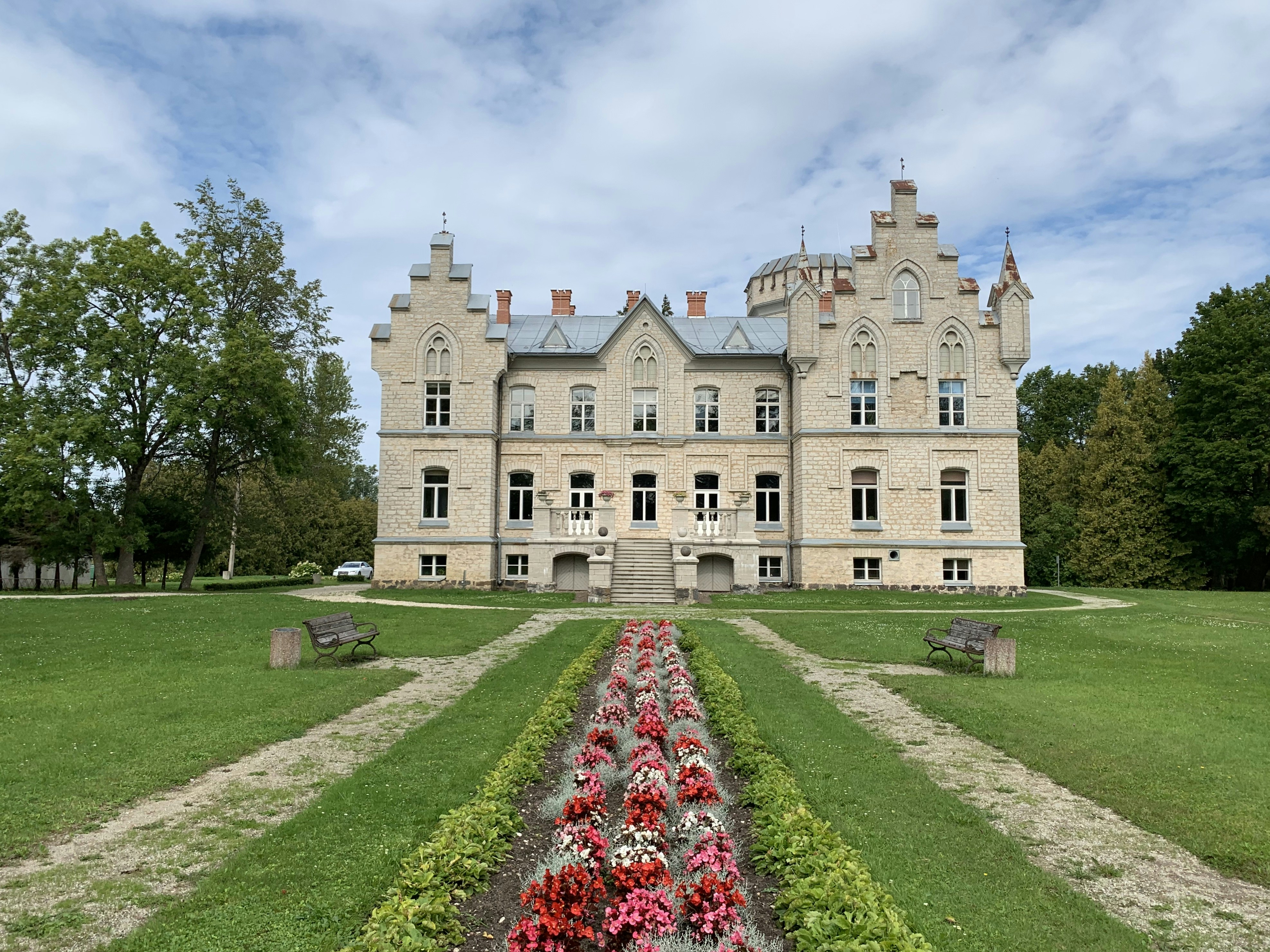 Symmetric Castle Drive: A Central Garden Path Framing a Grand Facade