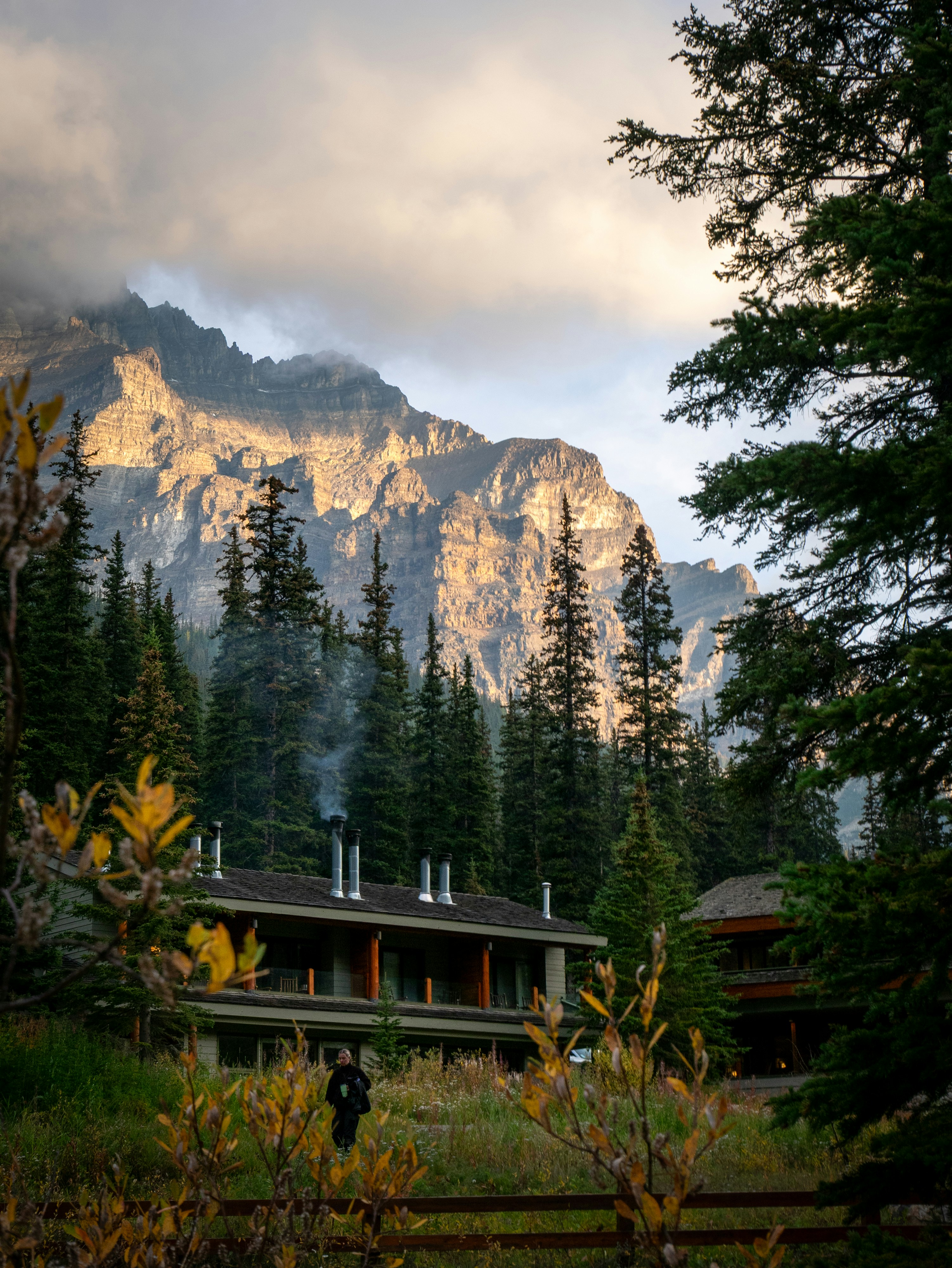 Echoes of the Peaks: Mountain Lodge Beneath Golden Light