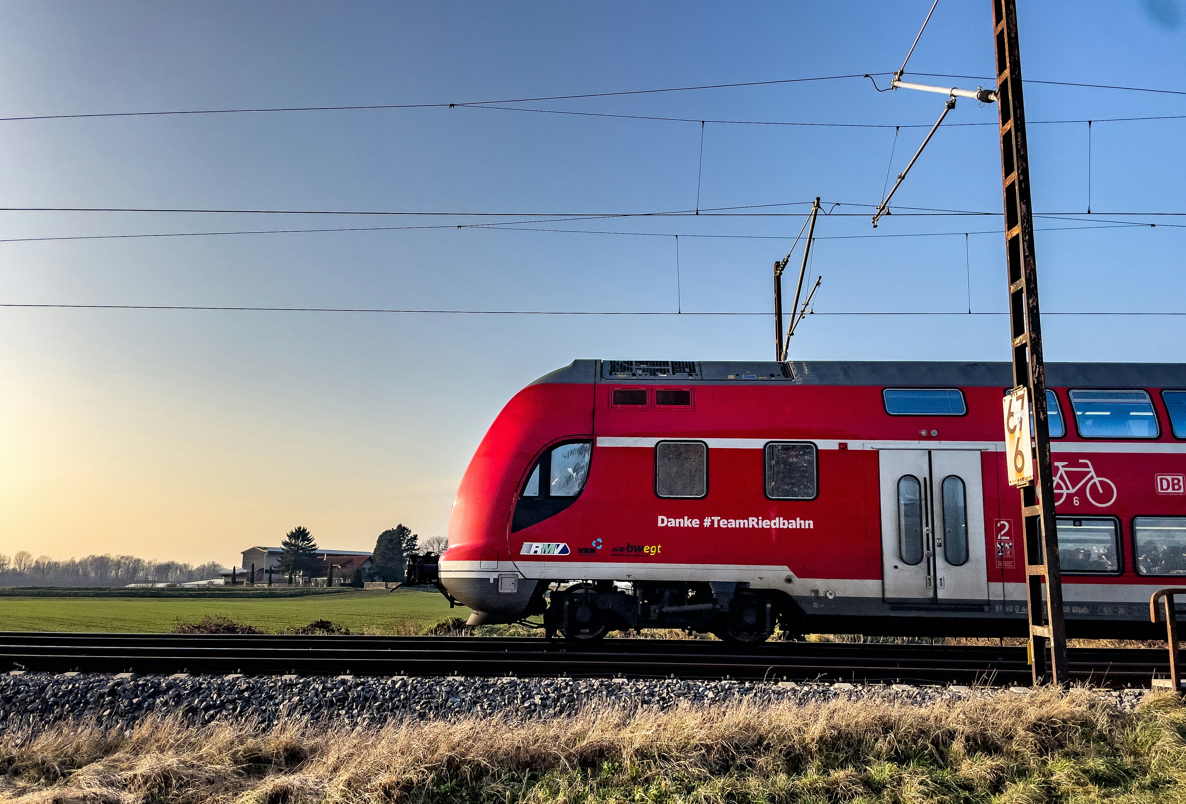 Red Intercity Glide: A Passenger Train Crossing the Horizon