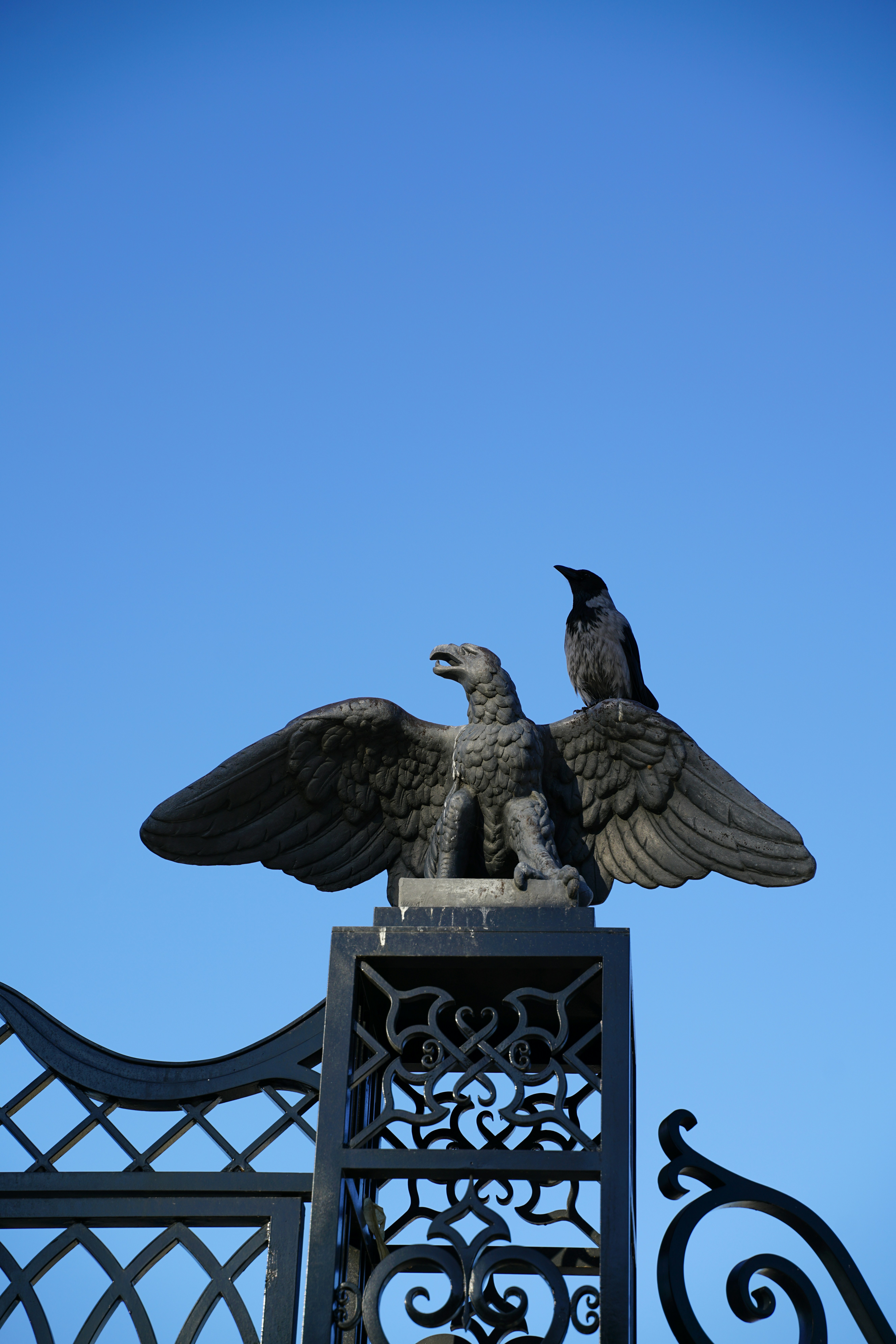 Winged Guardian over Ornate Gate