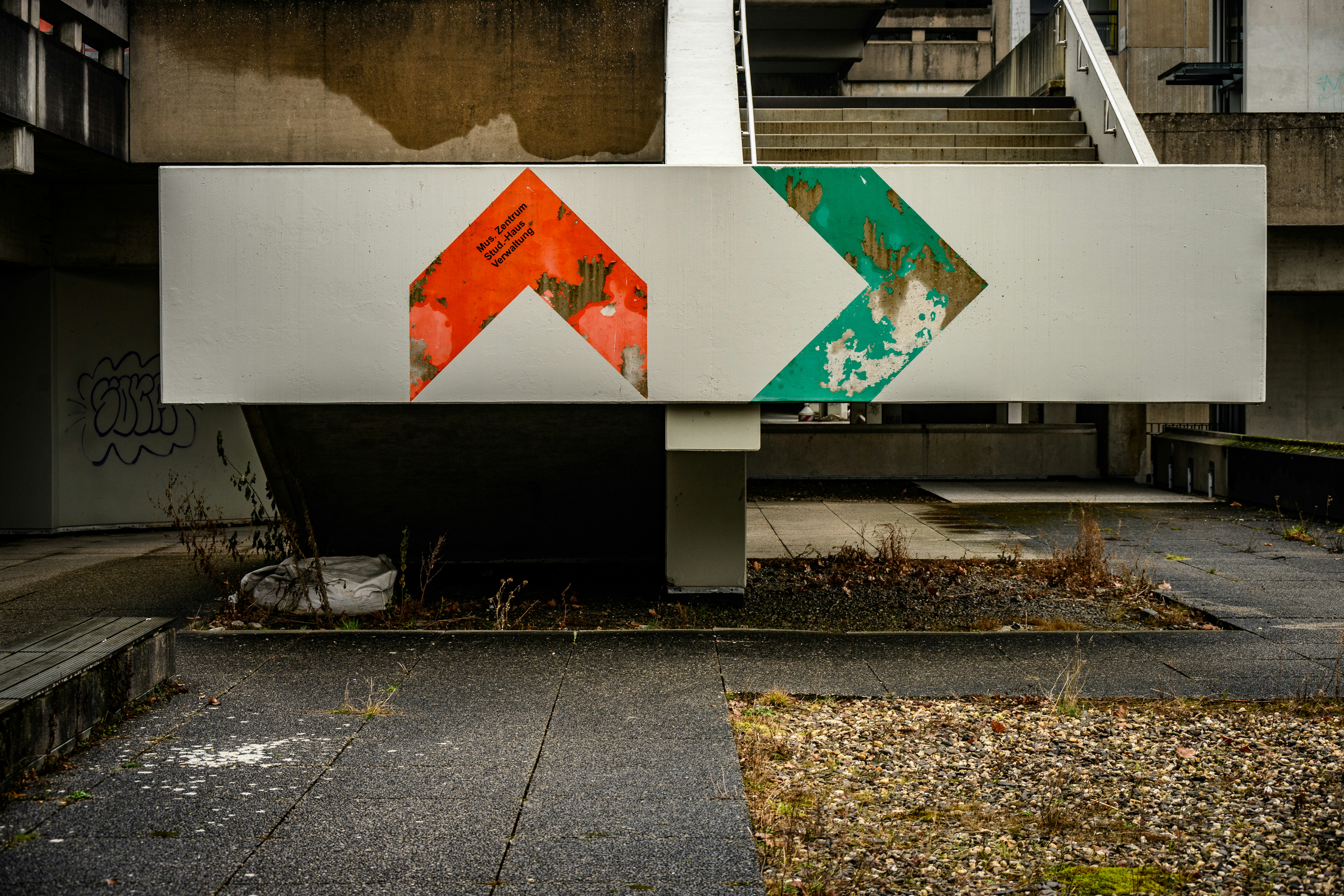 Abstract billboard echoes in a deserted concrete plaza