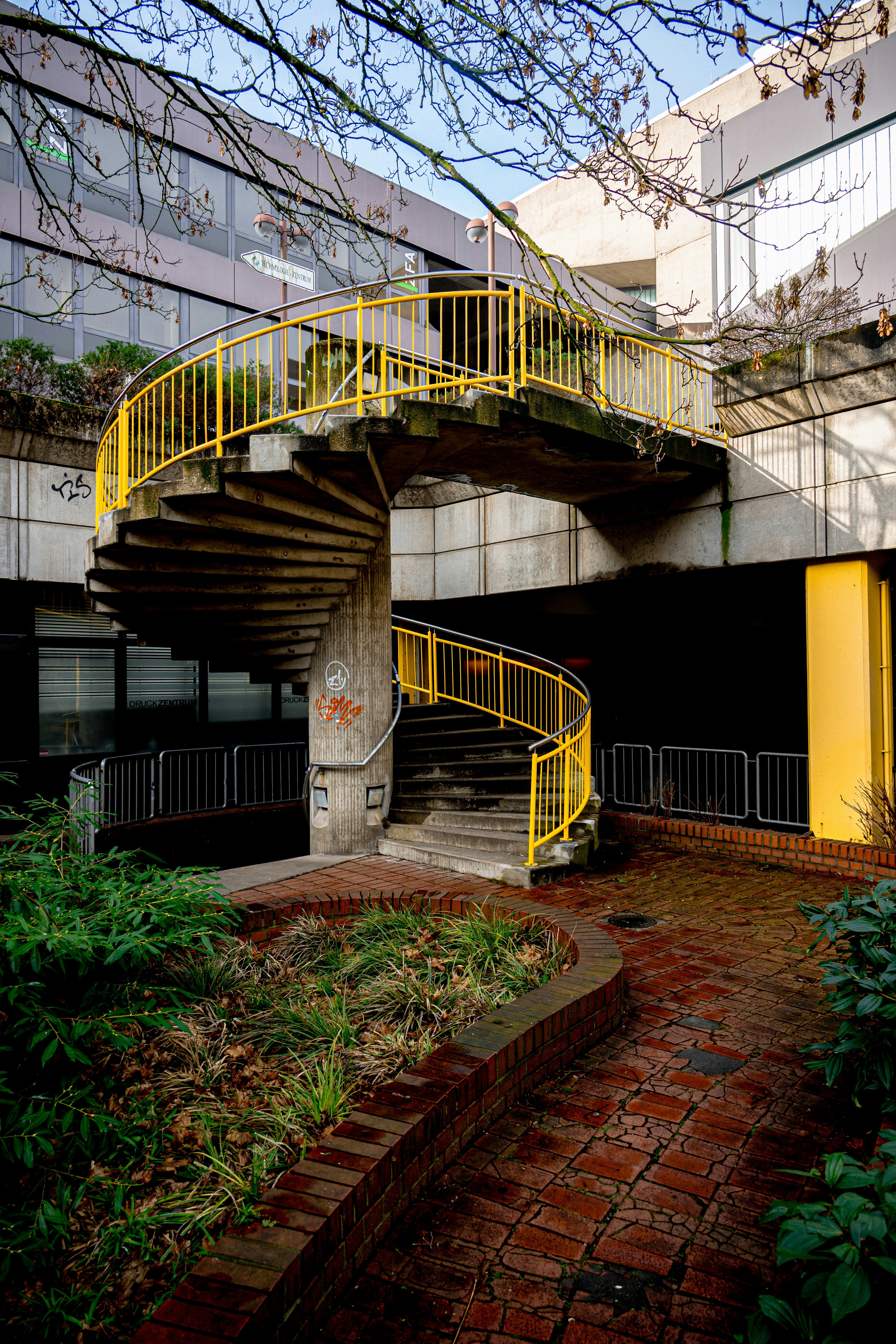 Yellow Railing Spiral: The Concrete Staircase Serenade