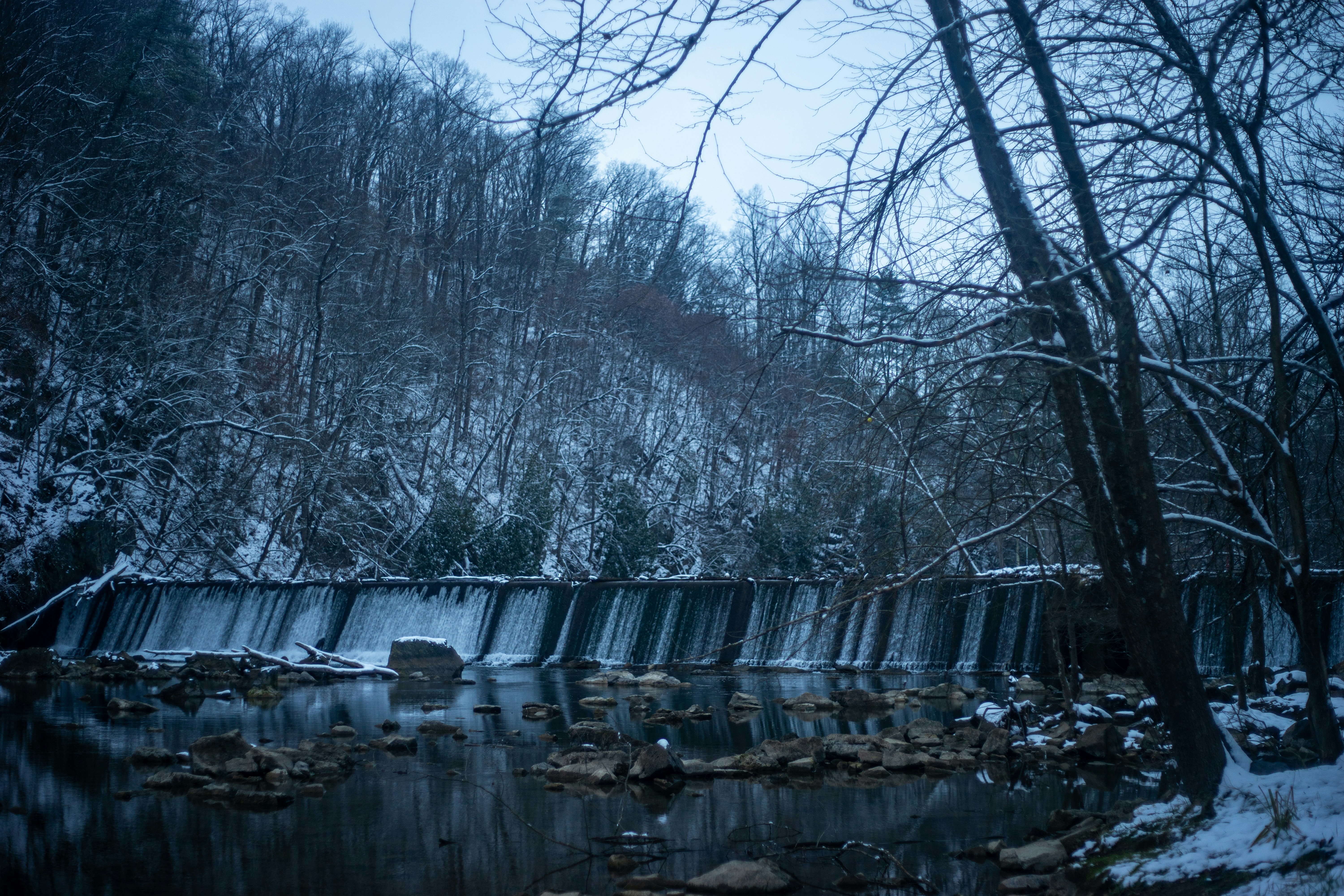 Winter Railroad Ruins: A Silent, Snow-Dusted River Bend