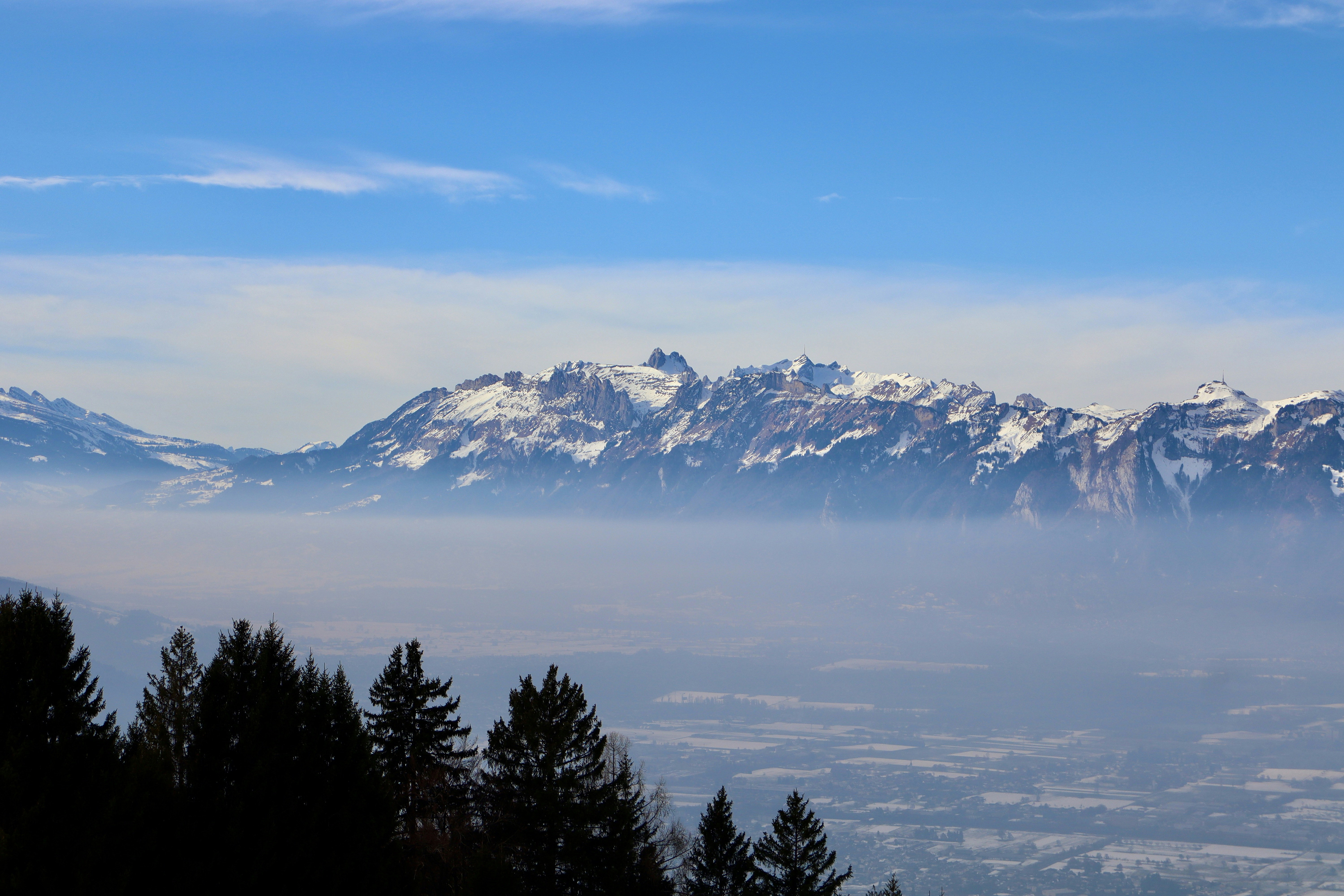 Snow-kissed Ridge above a Mist-kissed Valley