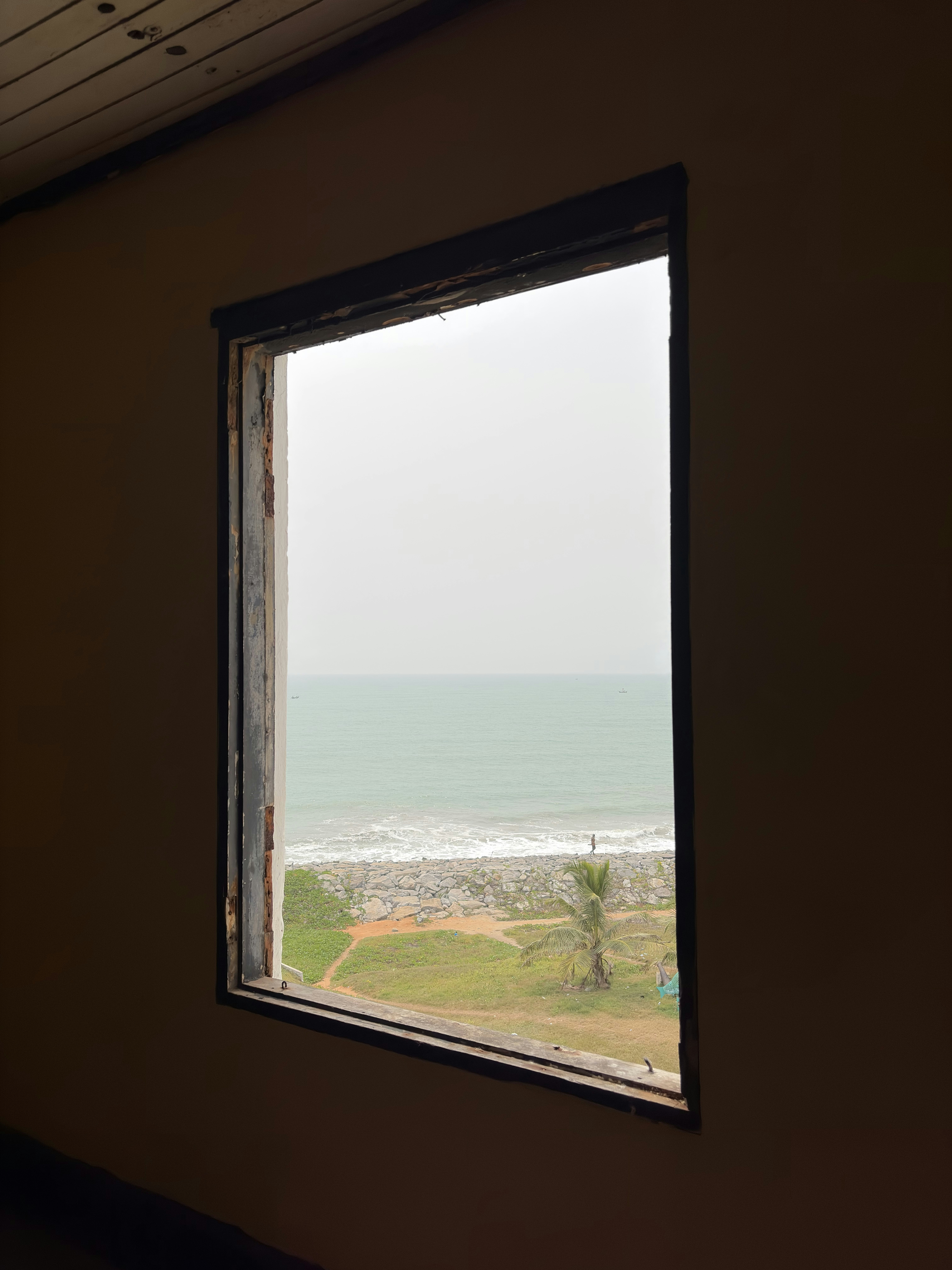 View of the ocean through a window frame