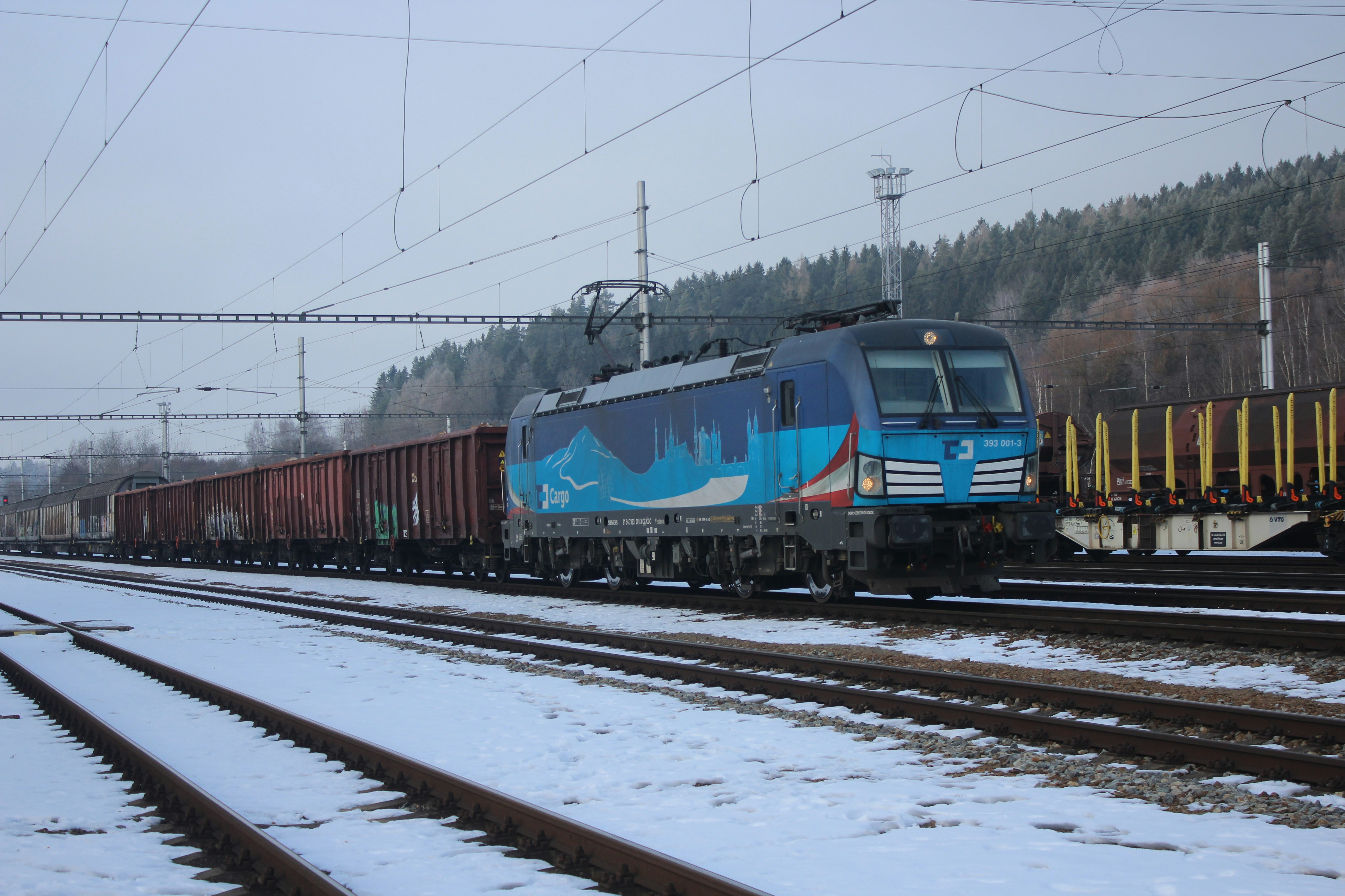 Locomotive Cresting the Snow-Blanketed Rails