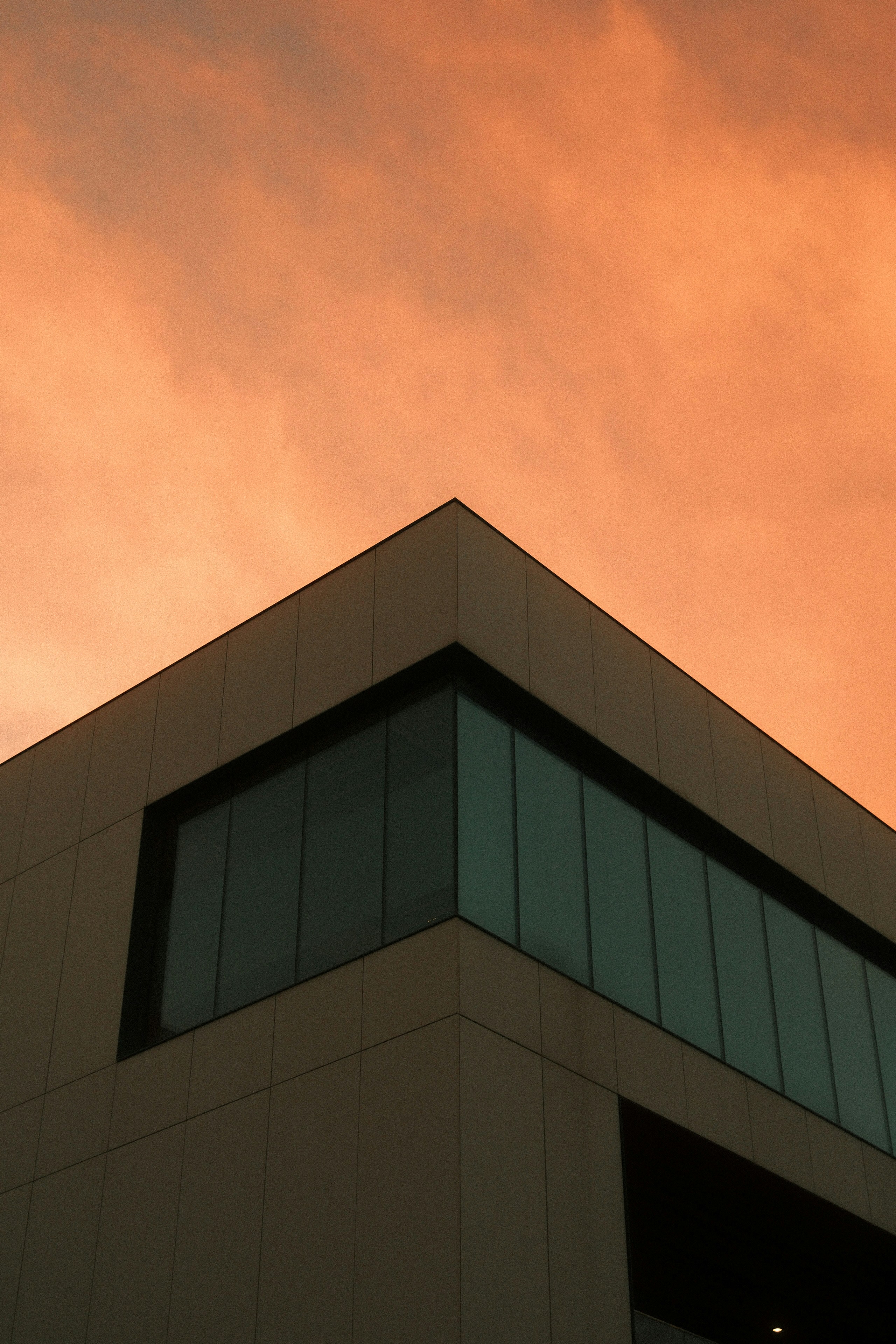Architectural Edge: The Corner Line Against a Sunset Sky