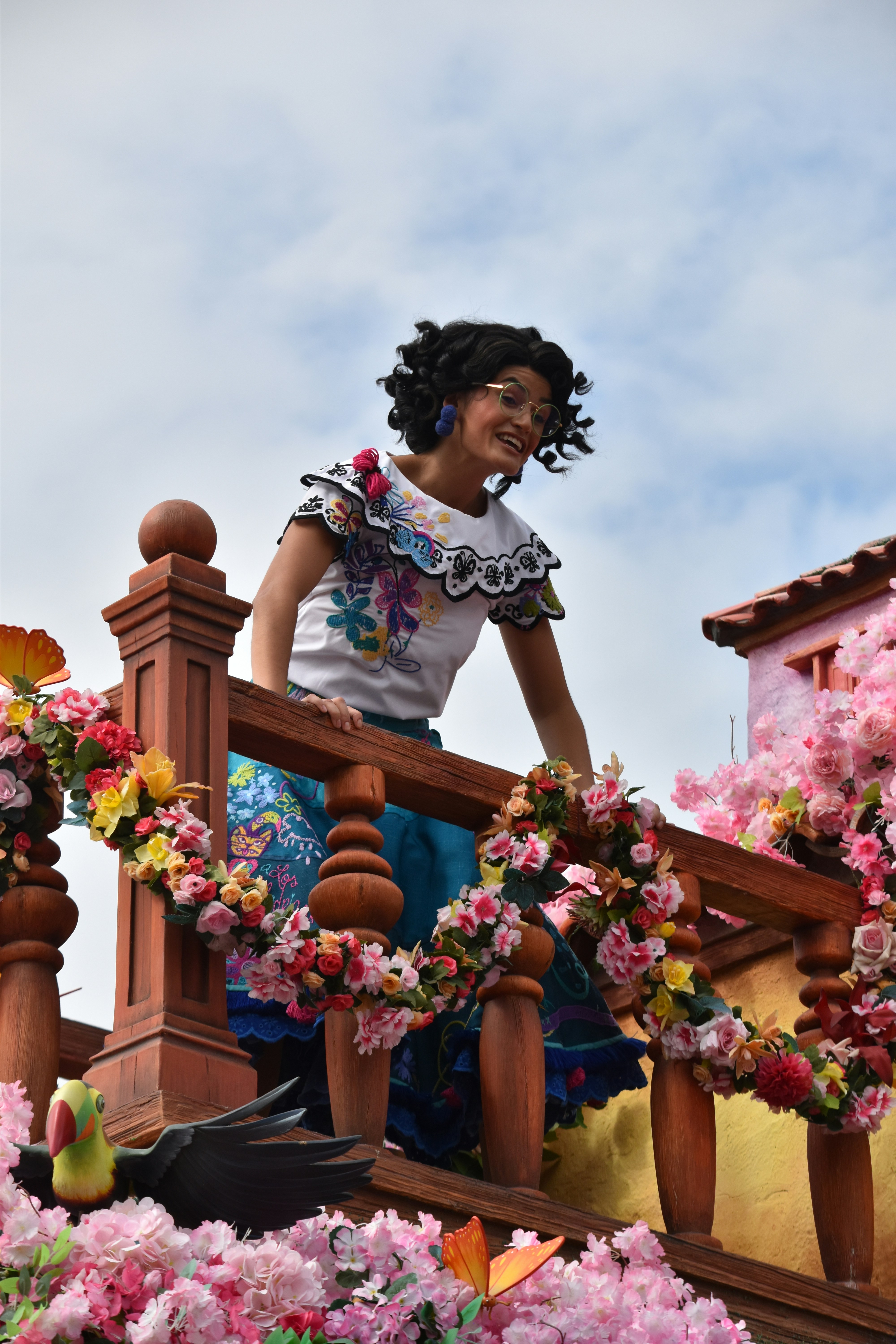 Joyful Parade of Floral Colors: A Girl On a Dreamy Balcony