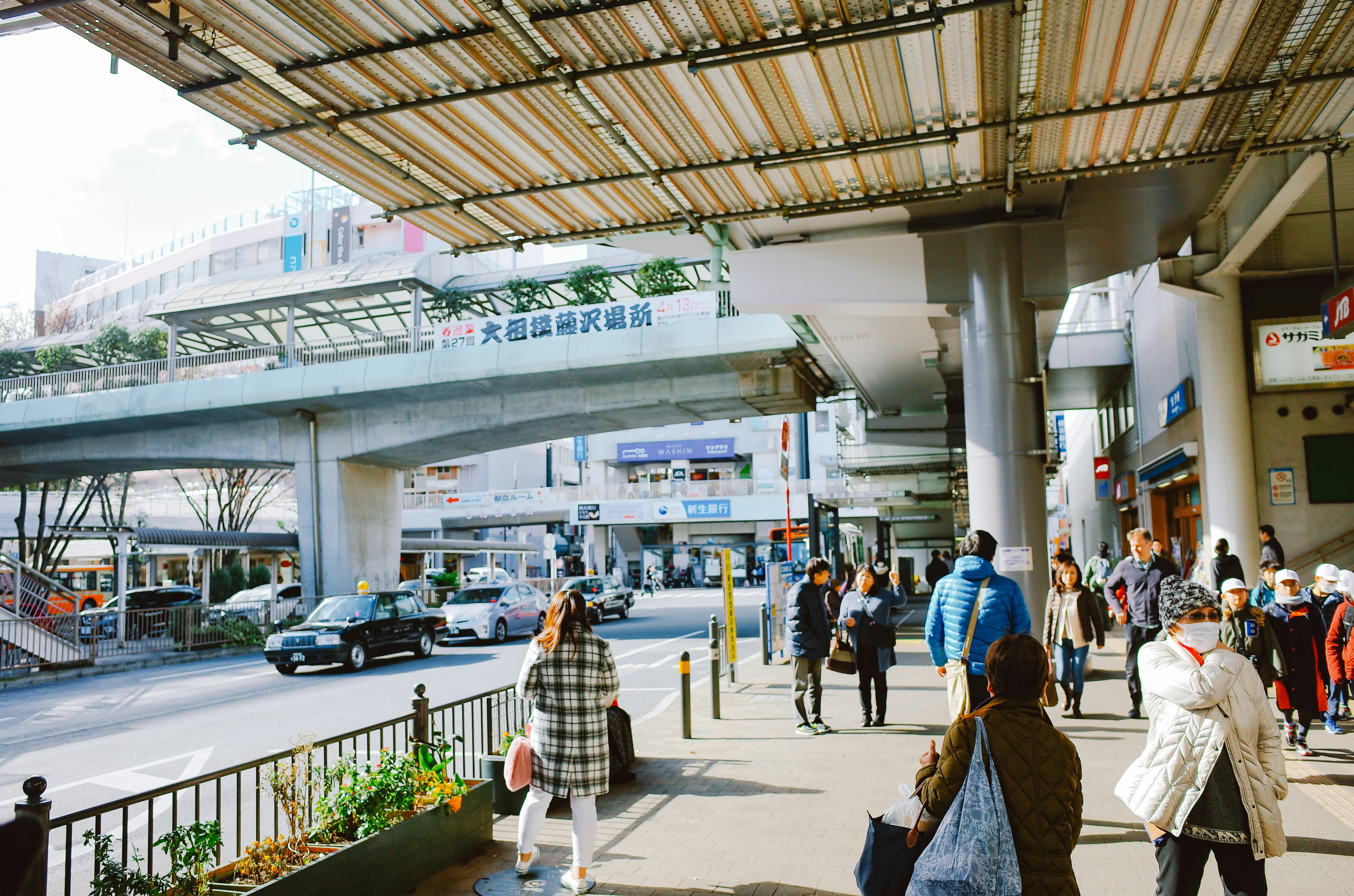 Crosswalk Voices: People at the Pedestrian Arcade Under the Transit Canopy