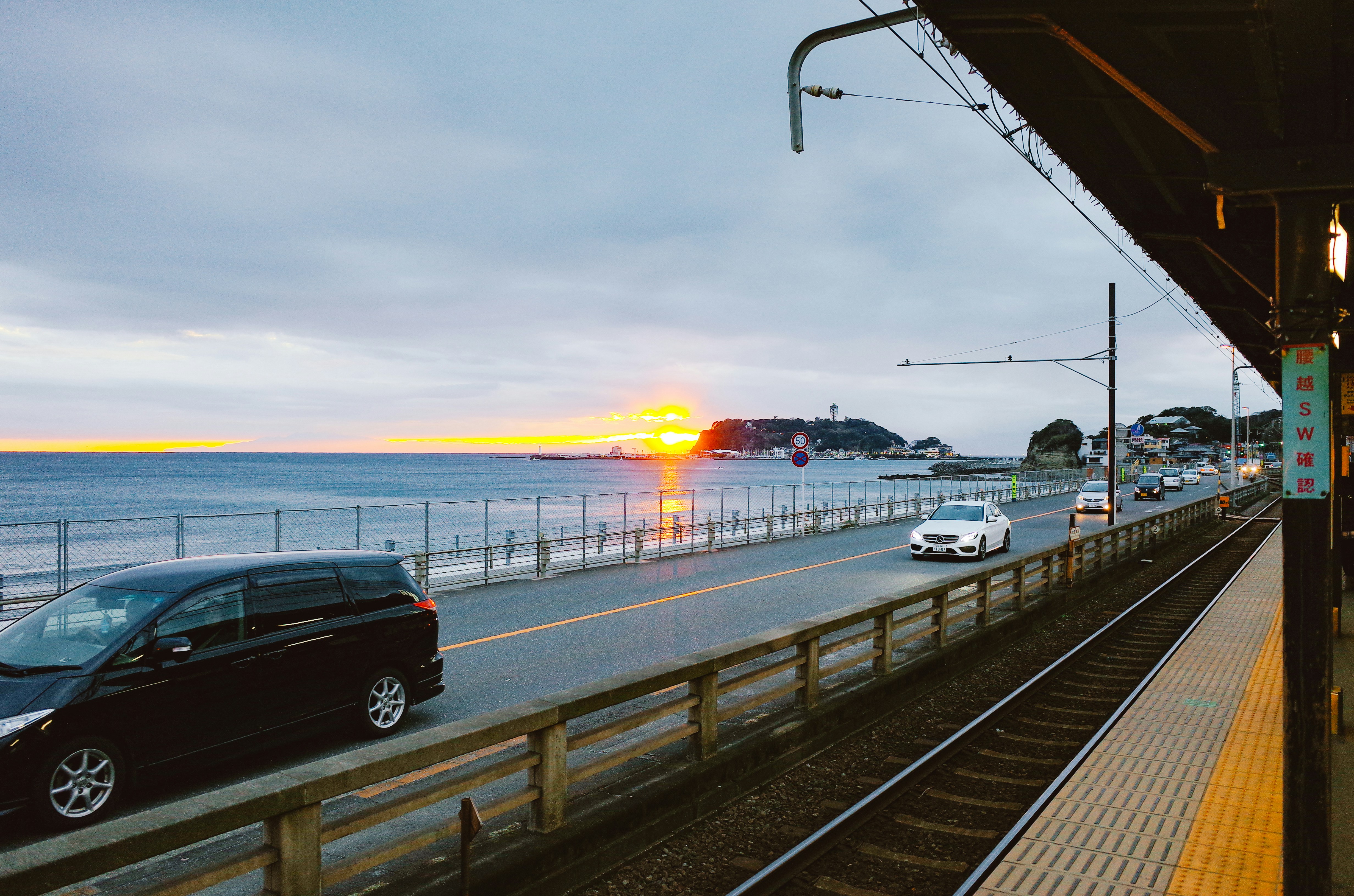 Sunset Sparks Over a Coastal Railway Line