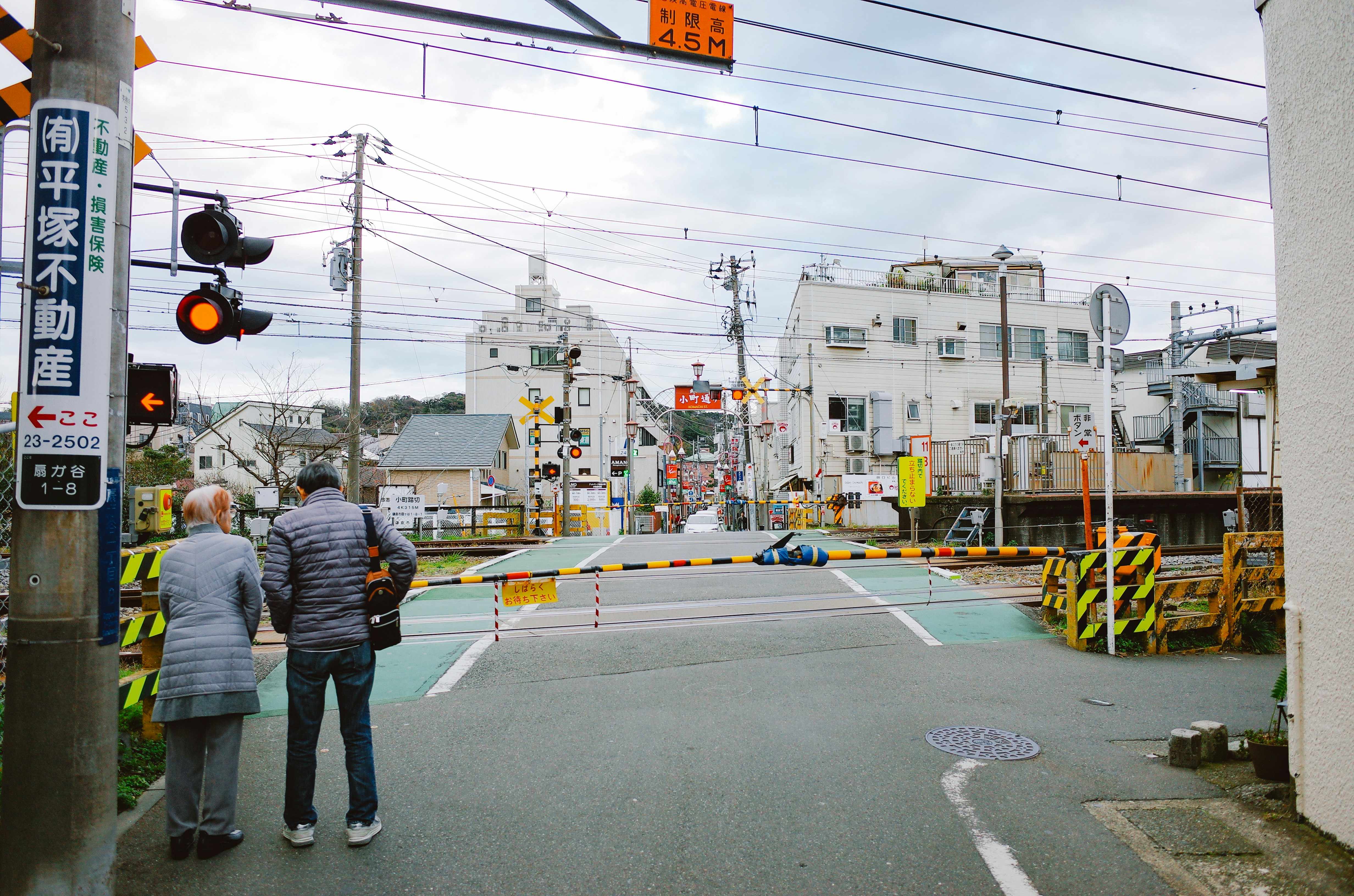 Crossing Guarded by Striped Barriers: A Quiet Street Scene
