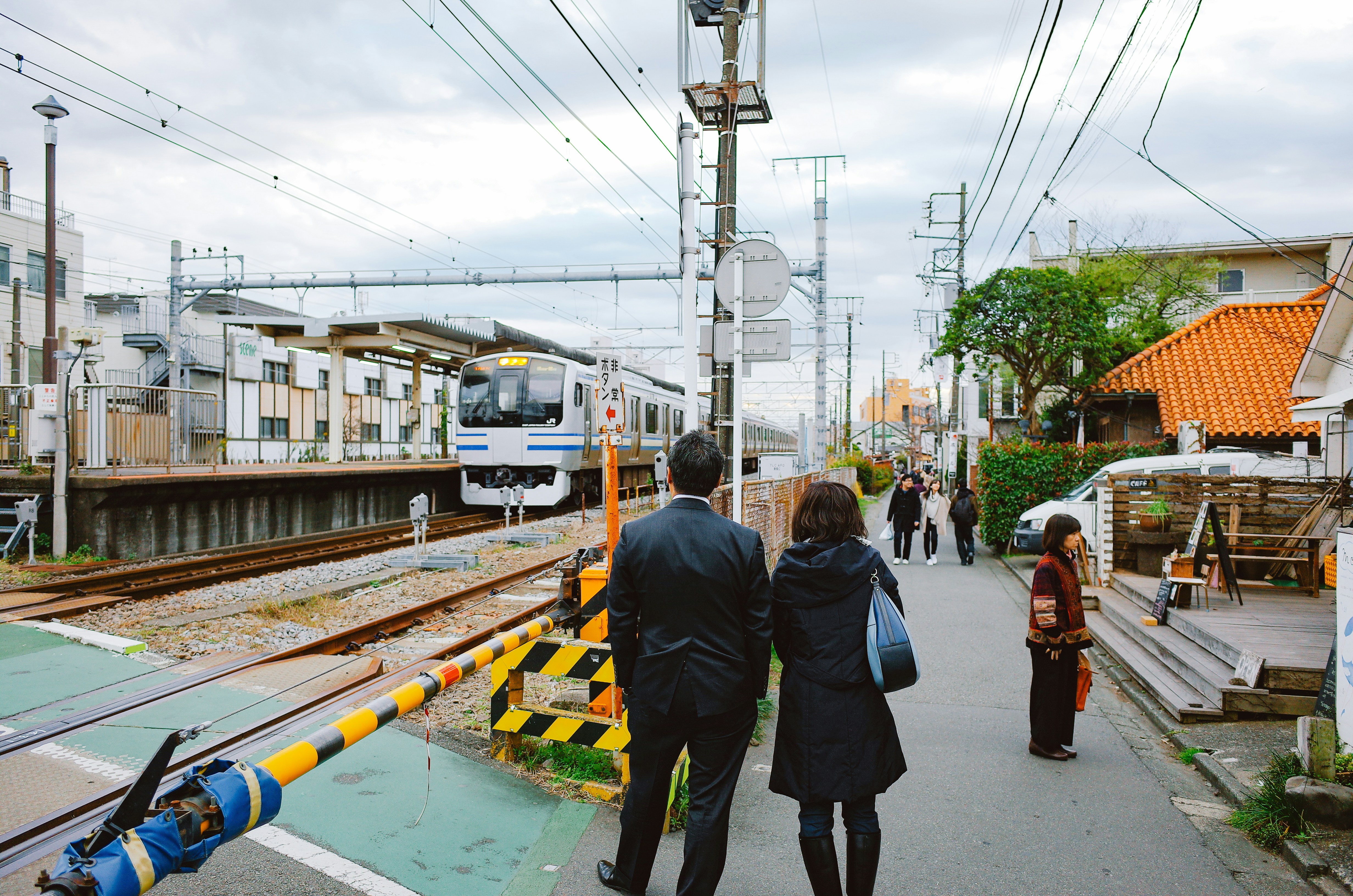 Railway Crossing in Quiet Suburban Station
