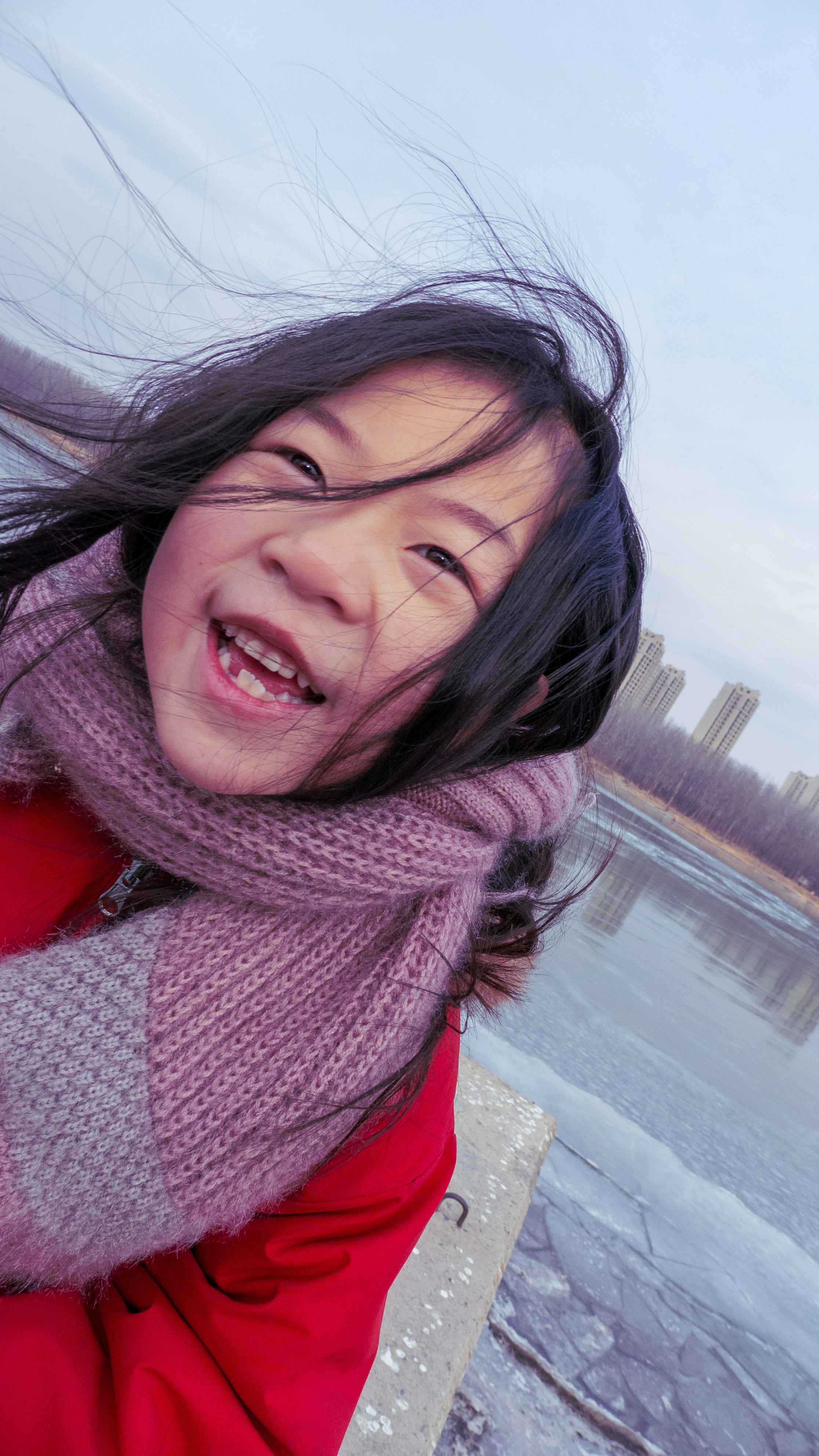 Windy Smile by the Riverbank