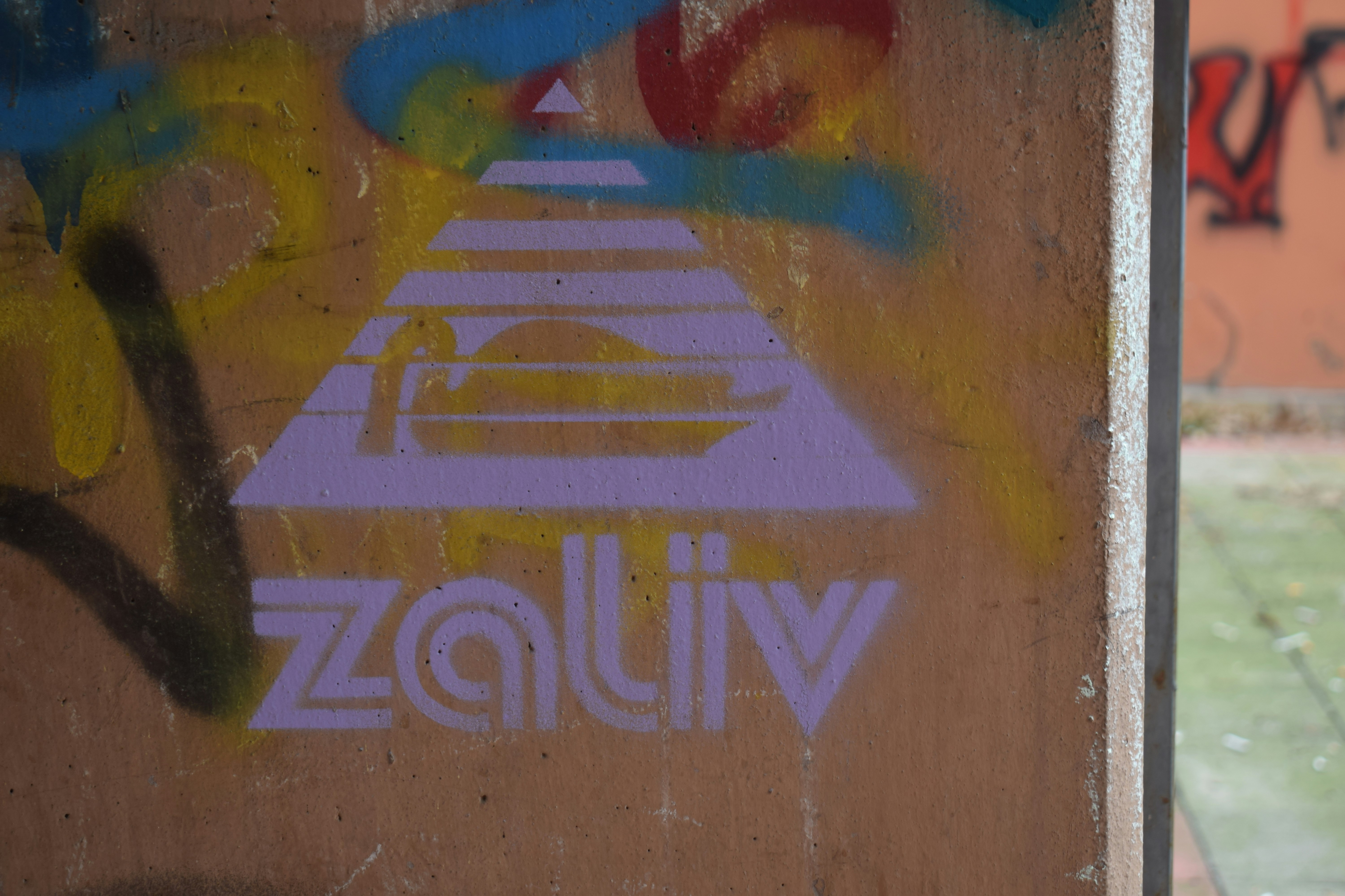 Graffiti Triangle Mark on Weathered Panel