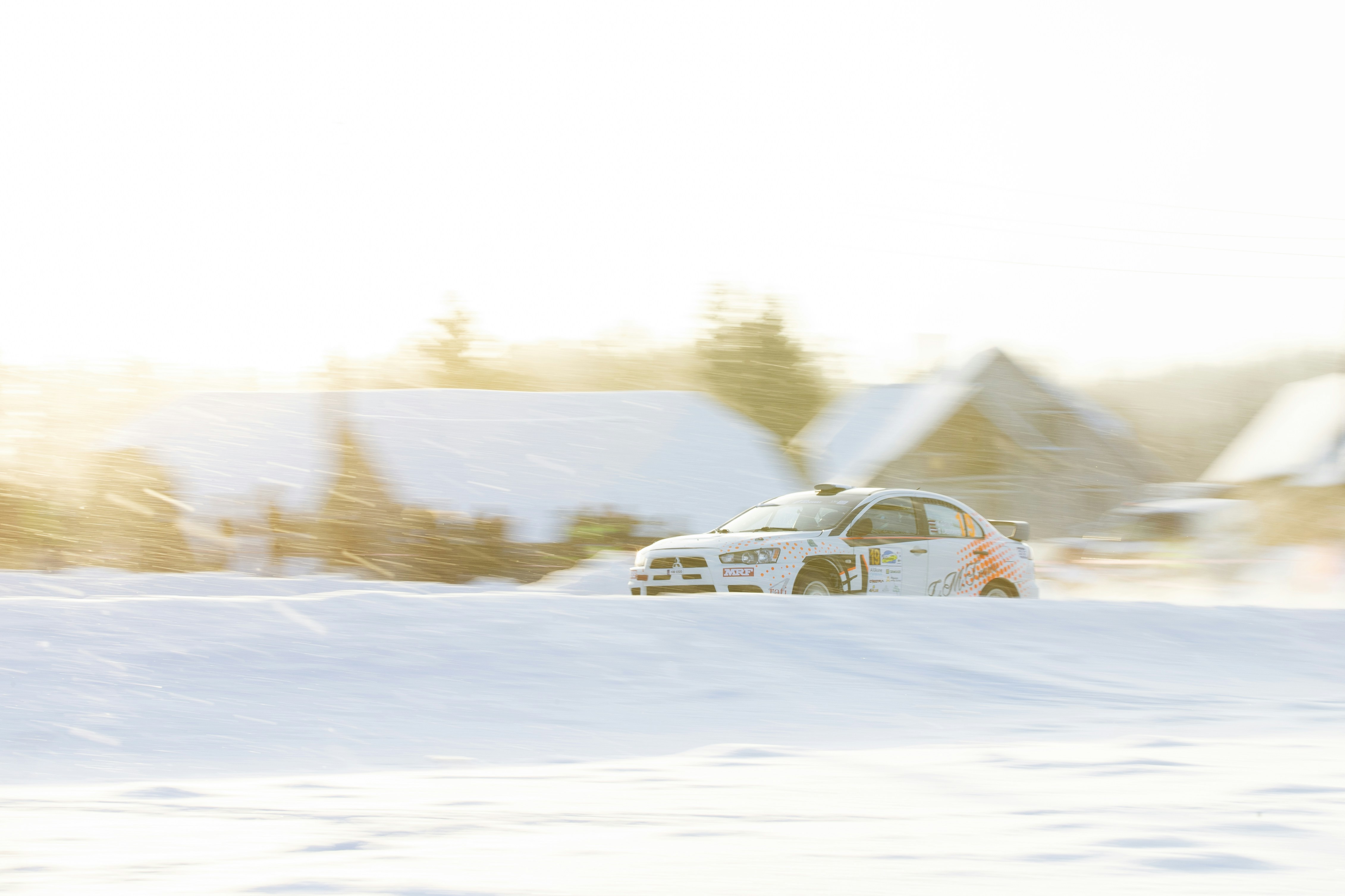 Snowbound Rally: A Car in a Quiet Blizzard Parade