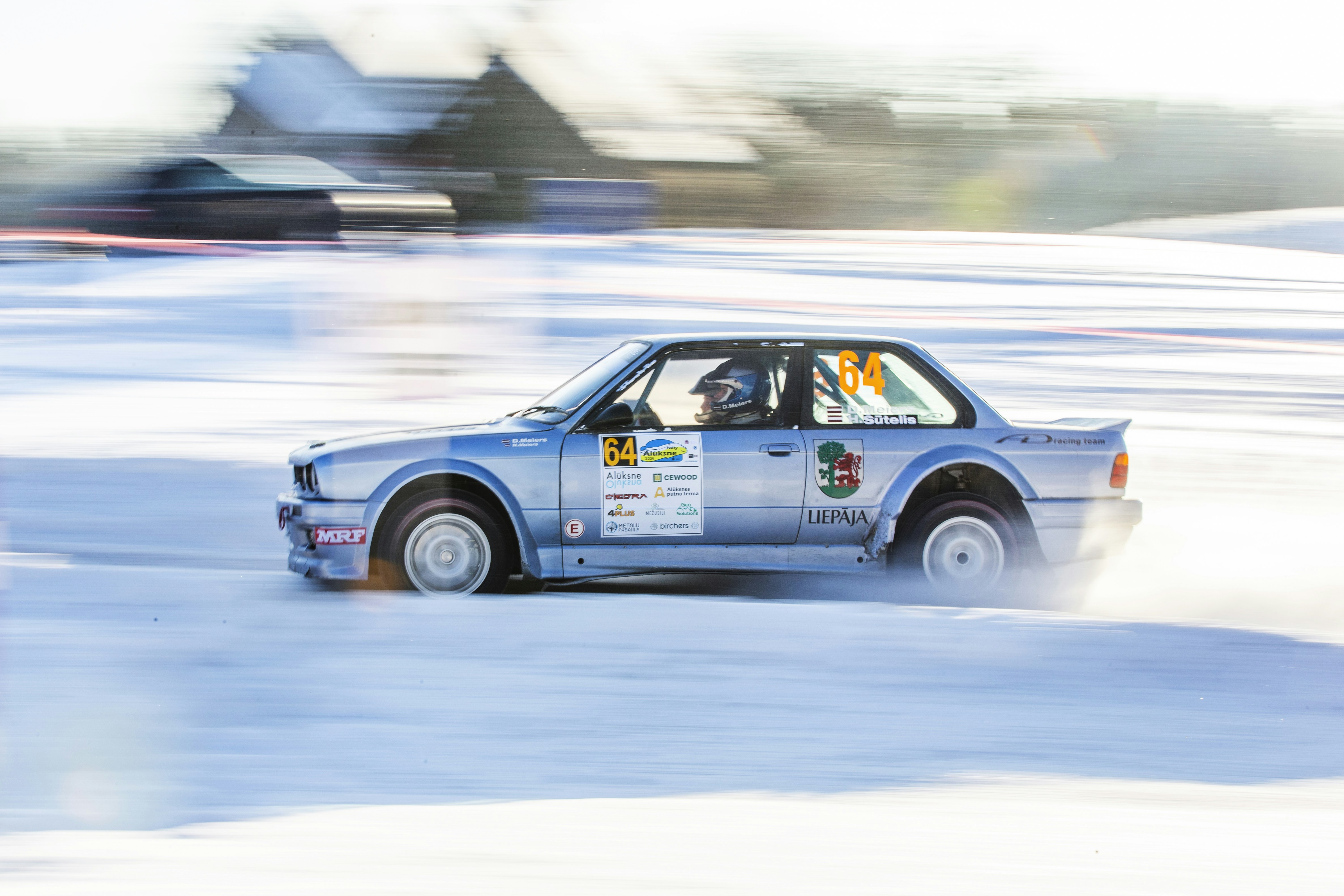 Blue Rally Car Slices Through Snow