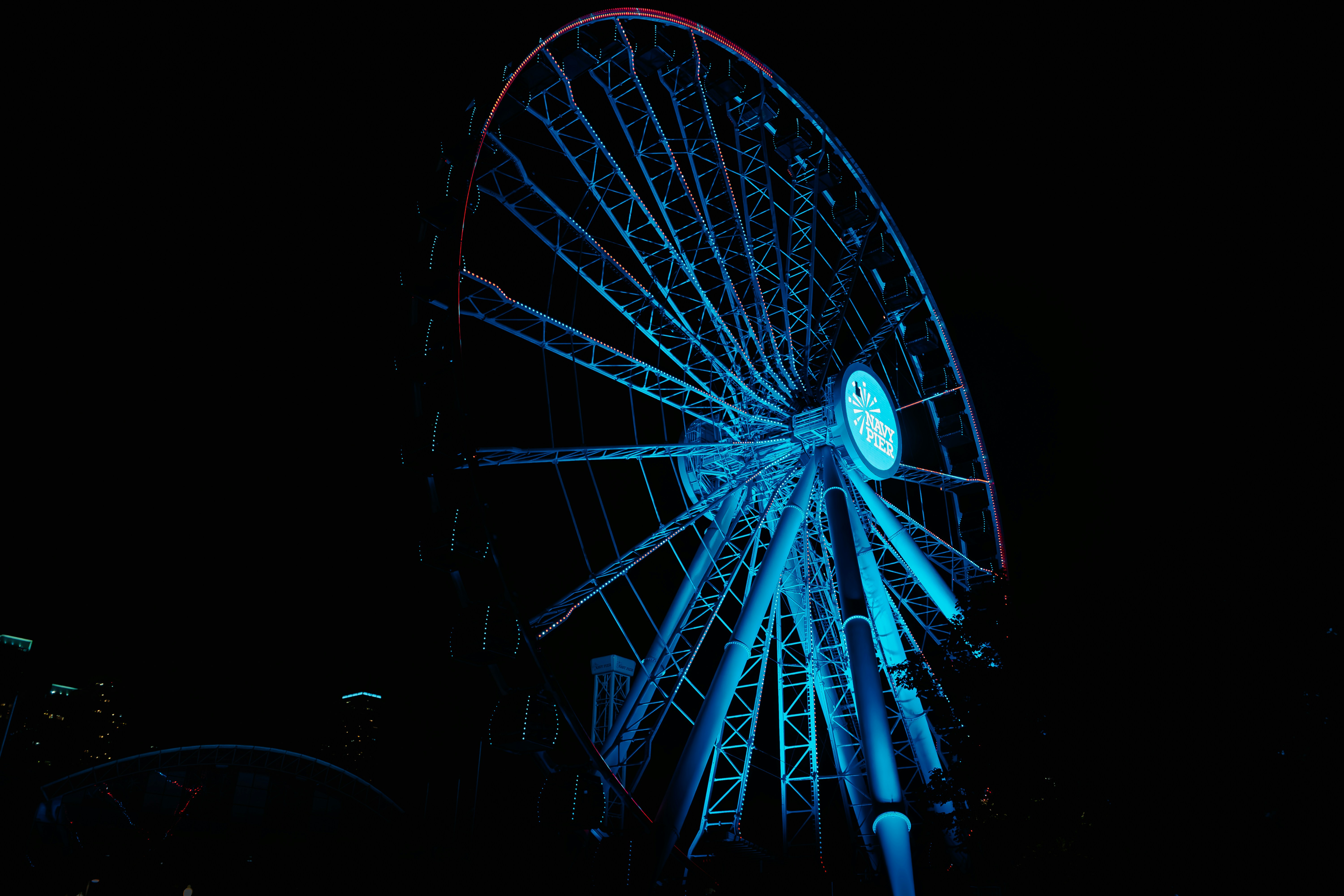 Neon Night Wheel: A Blue-Glowed Ferris Structure Cuts the Dark