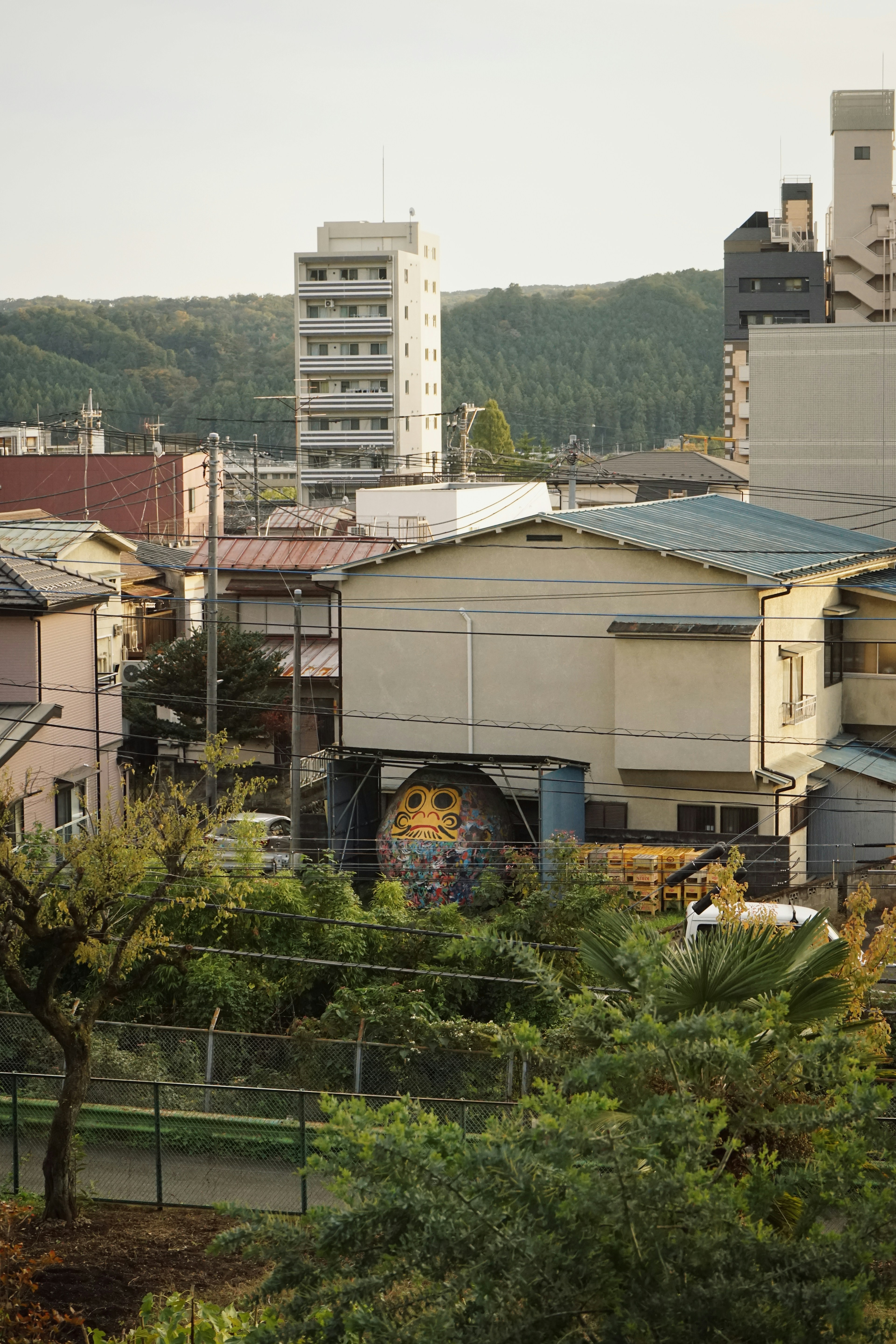 Hidden Matryoshka of the City: A Quiet Façade Beneath Urban Skies