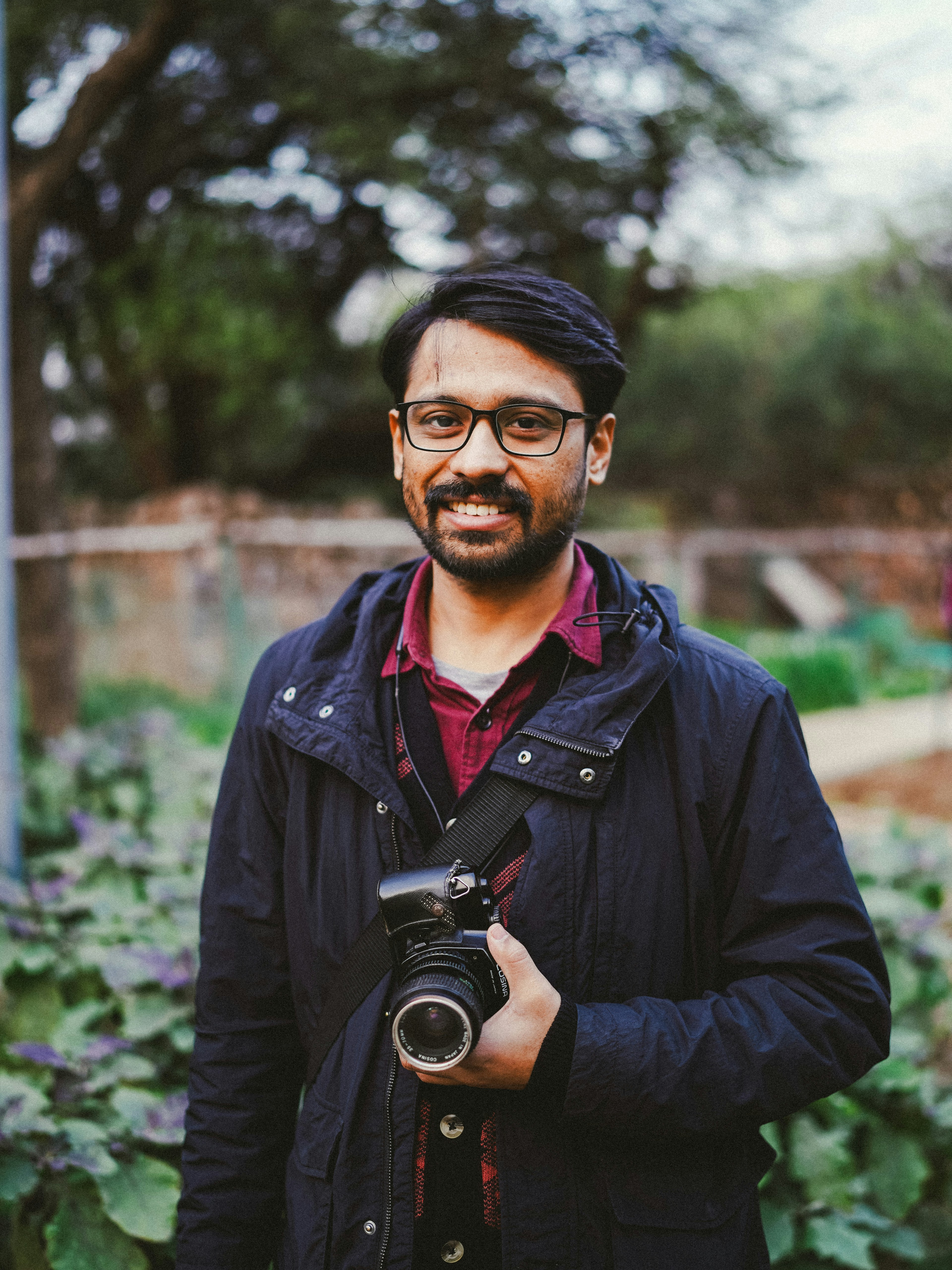 Portrait of a photographer in a garden studio