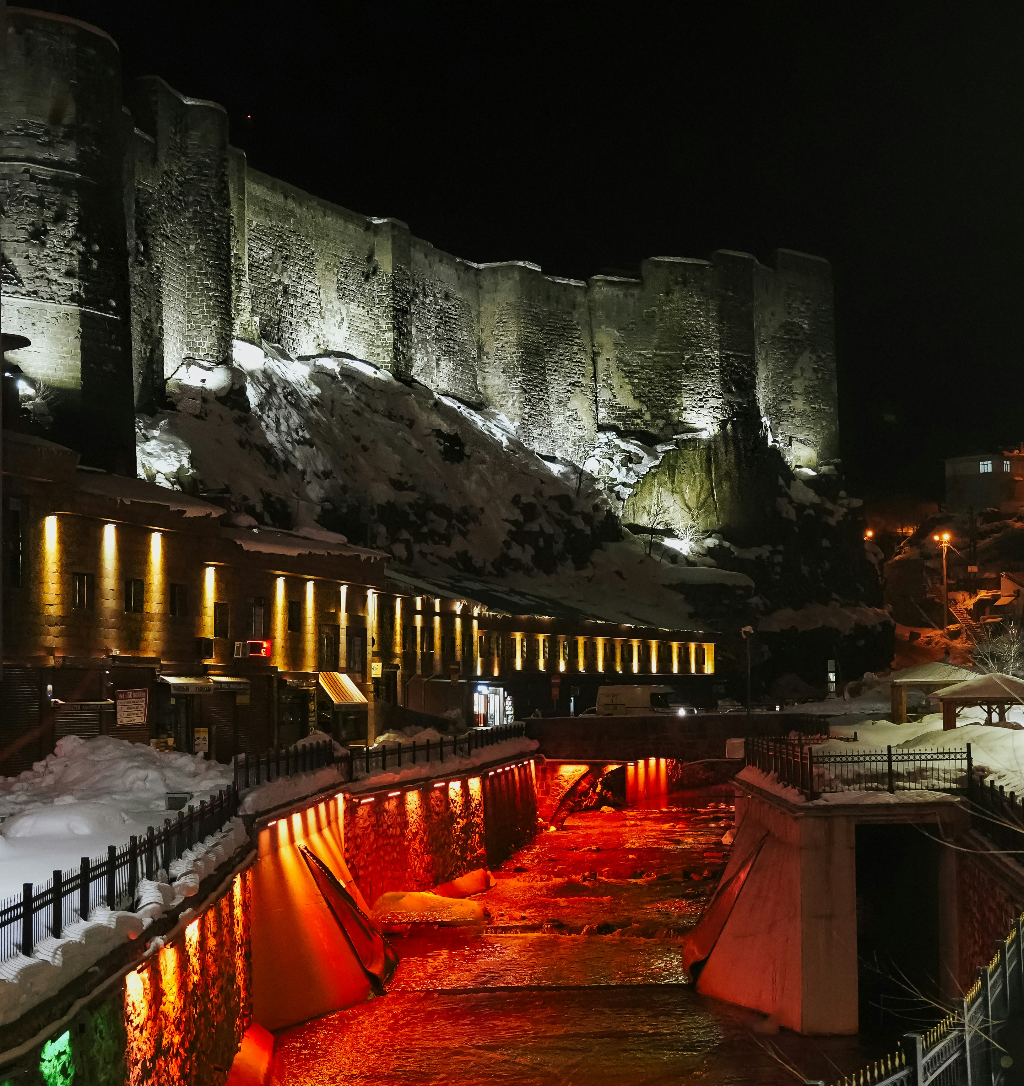 Gilded Waterway Beneath Snowbound Fortress