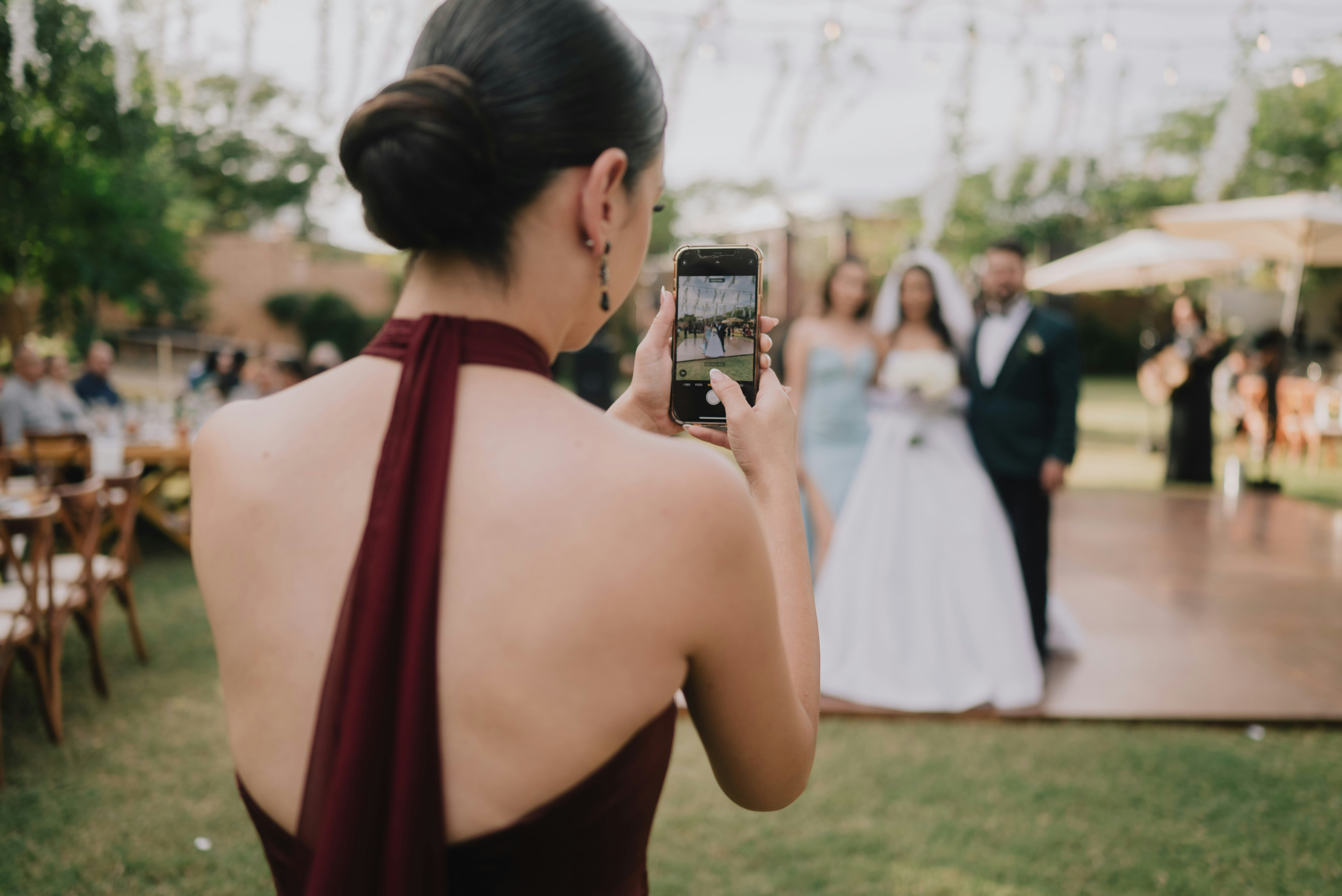 In Focus at the Altar: A Bride’s Moment Captured by a Friend on Stage