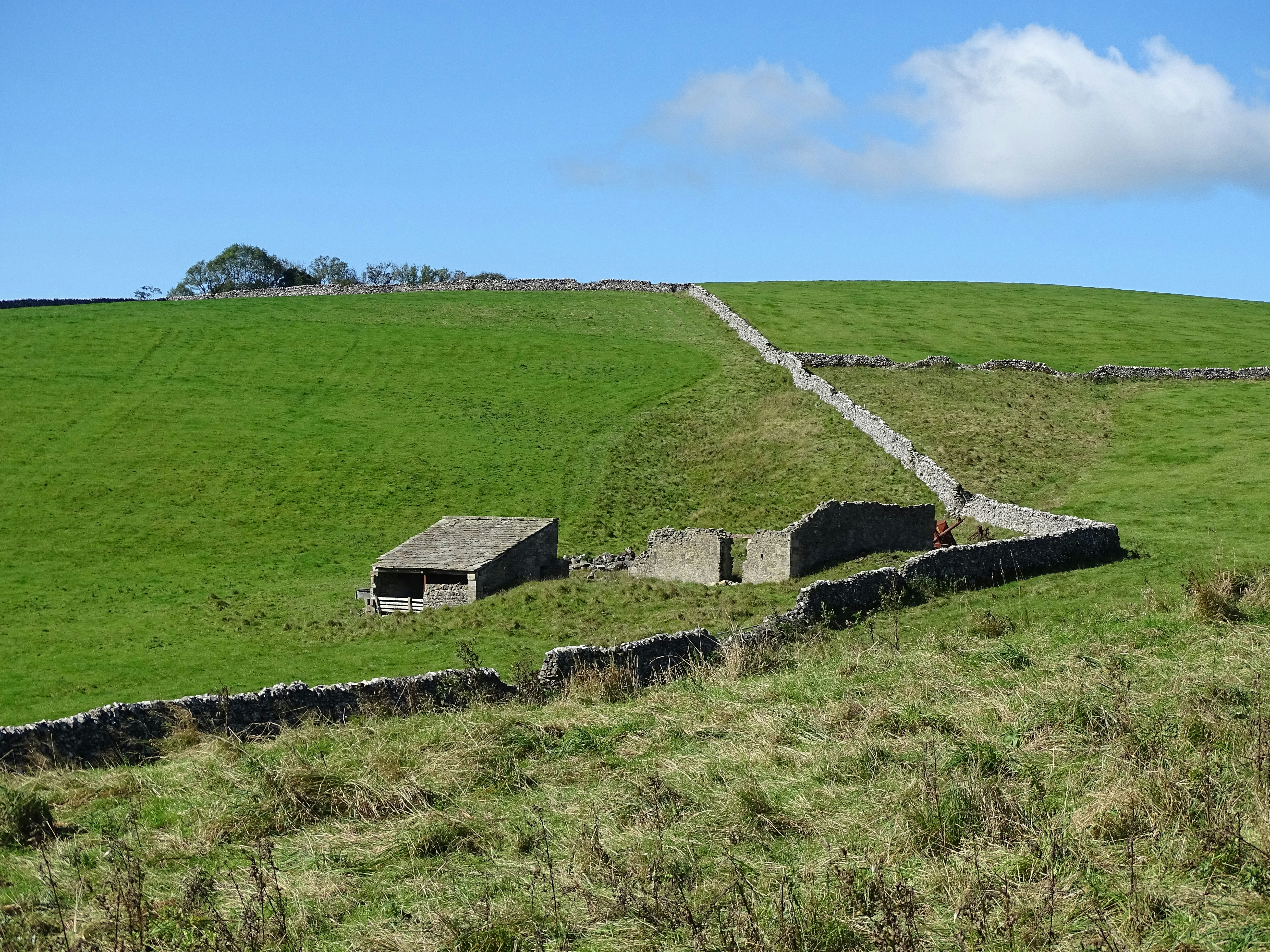 Ruined stone buildings on a green grassy hill. photo – Free Countryside ...