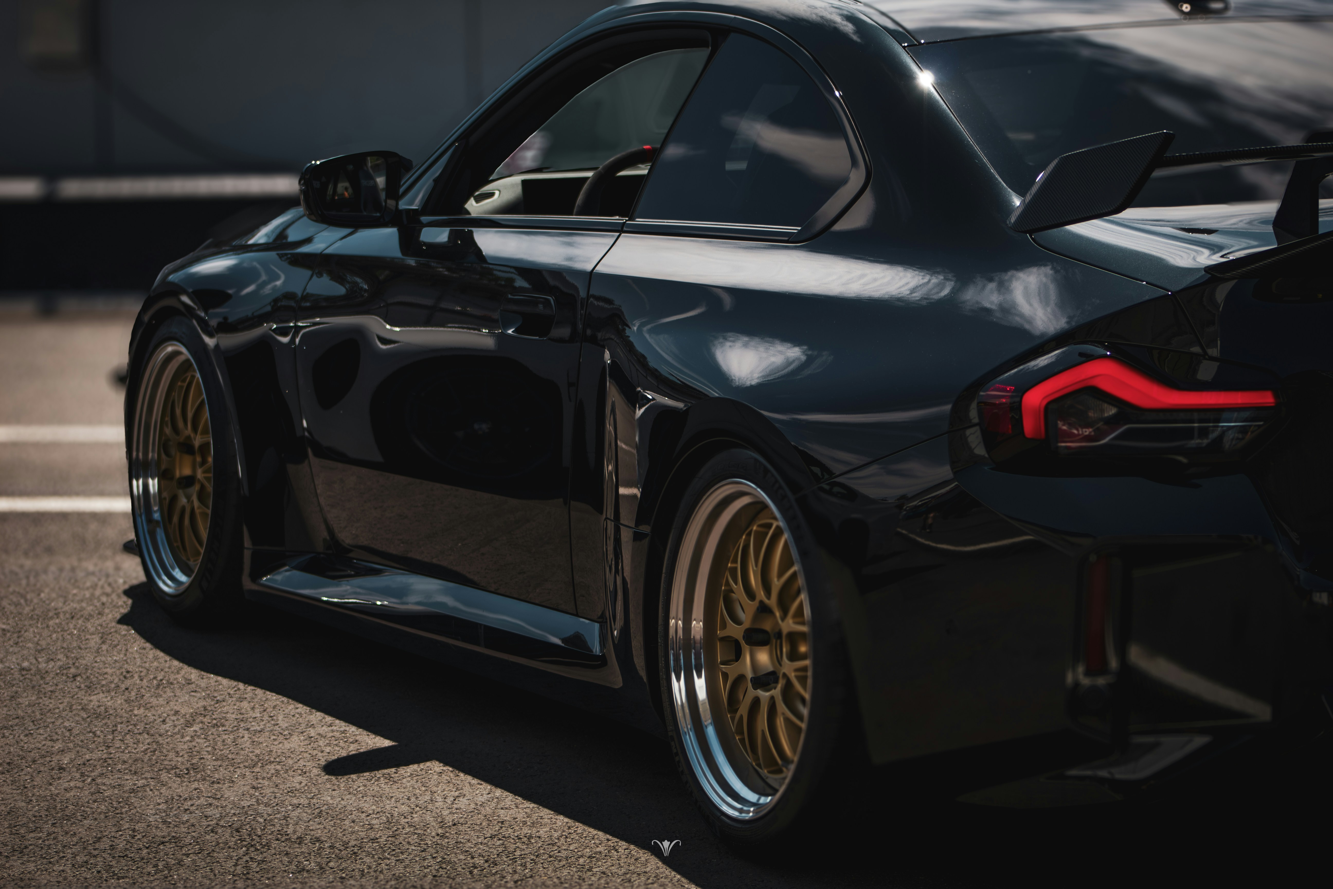 Midnight Specter: A Wide Stance of Carbon Asphalt and Gold