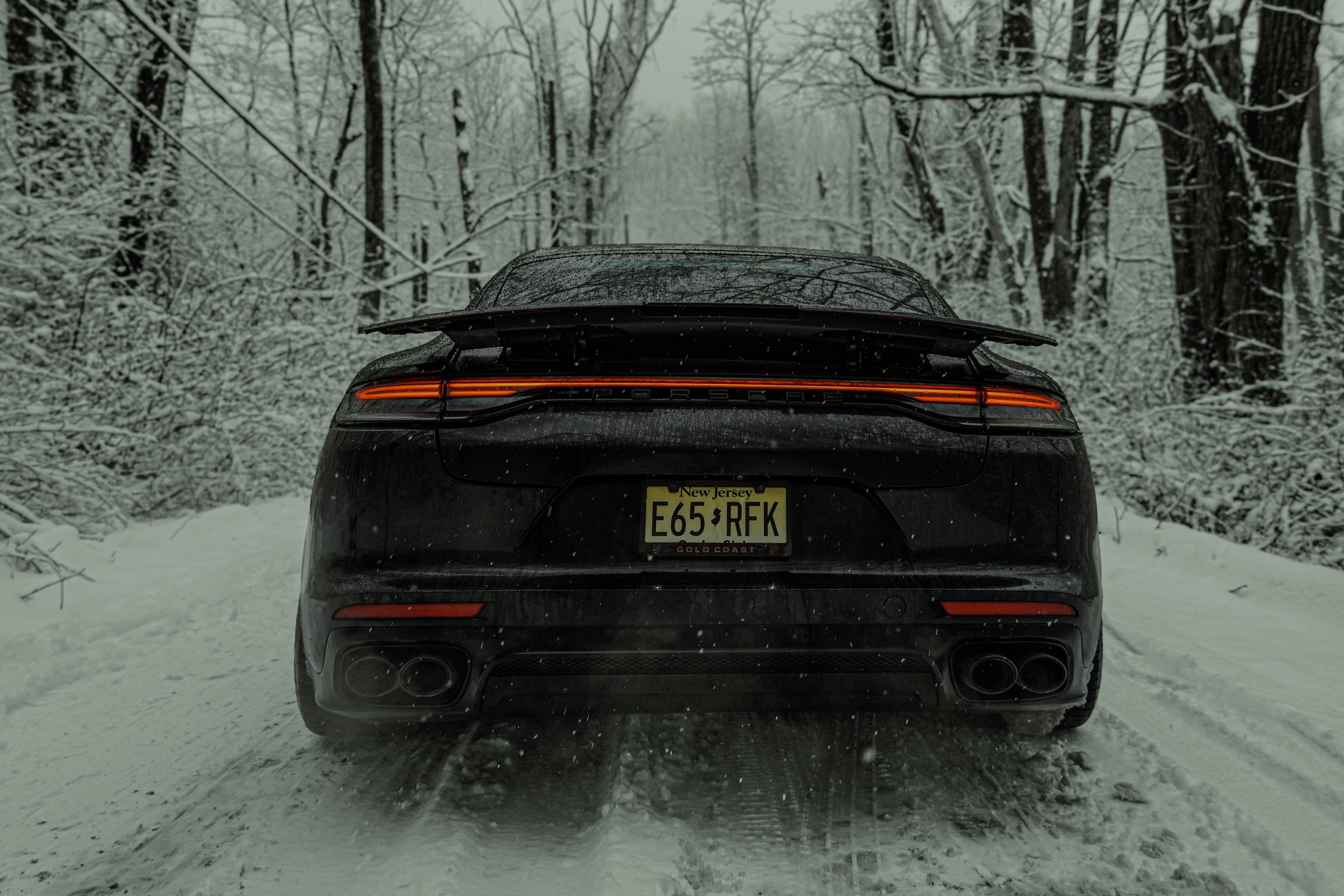 Snowbound Sedan: A Sunset-Lit Escape Through a Winter Road