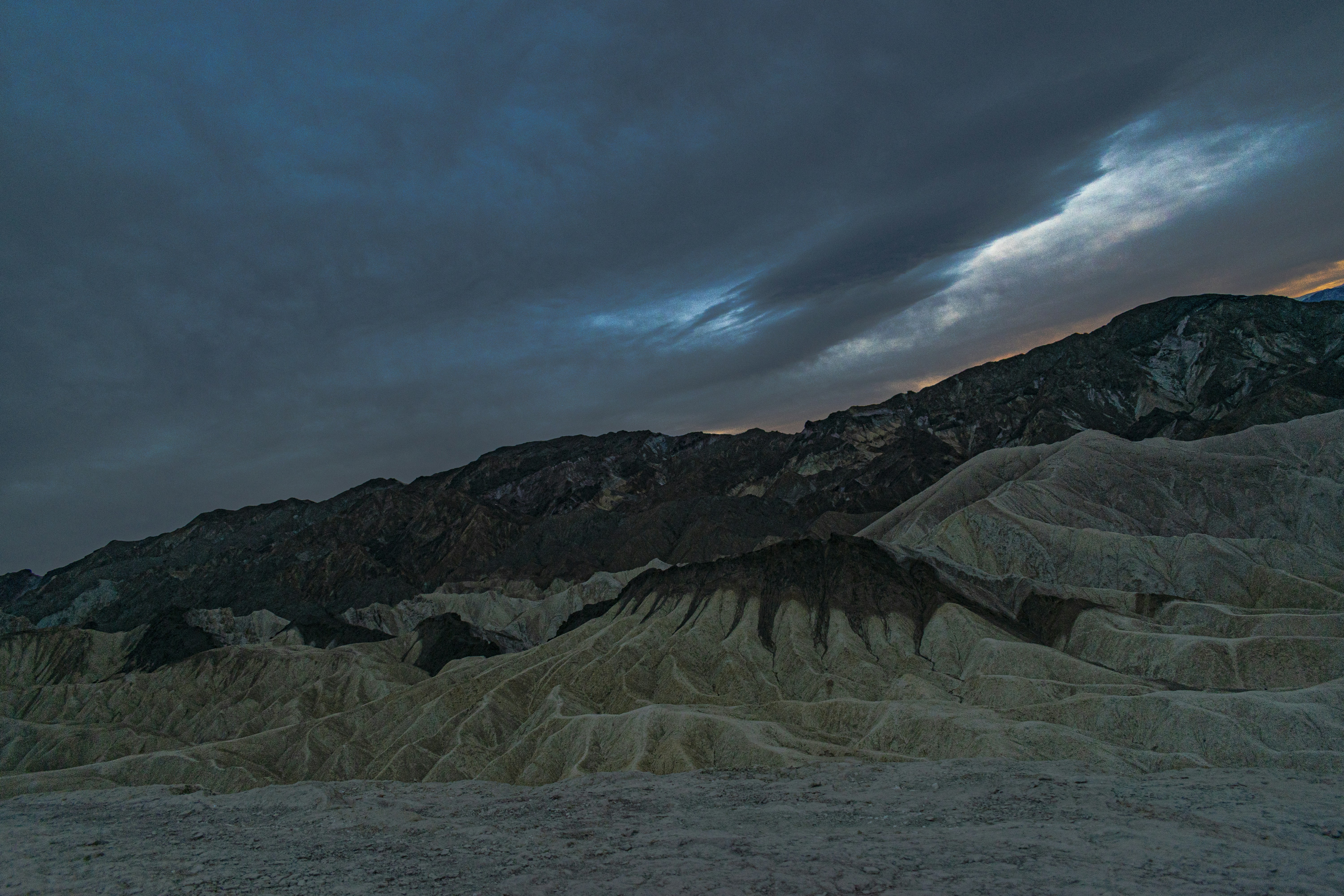 Twilight Peaks Over Staircased Desert Formations