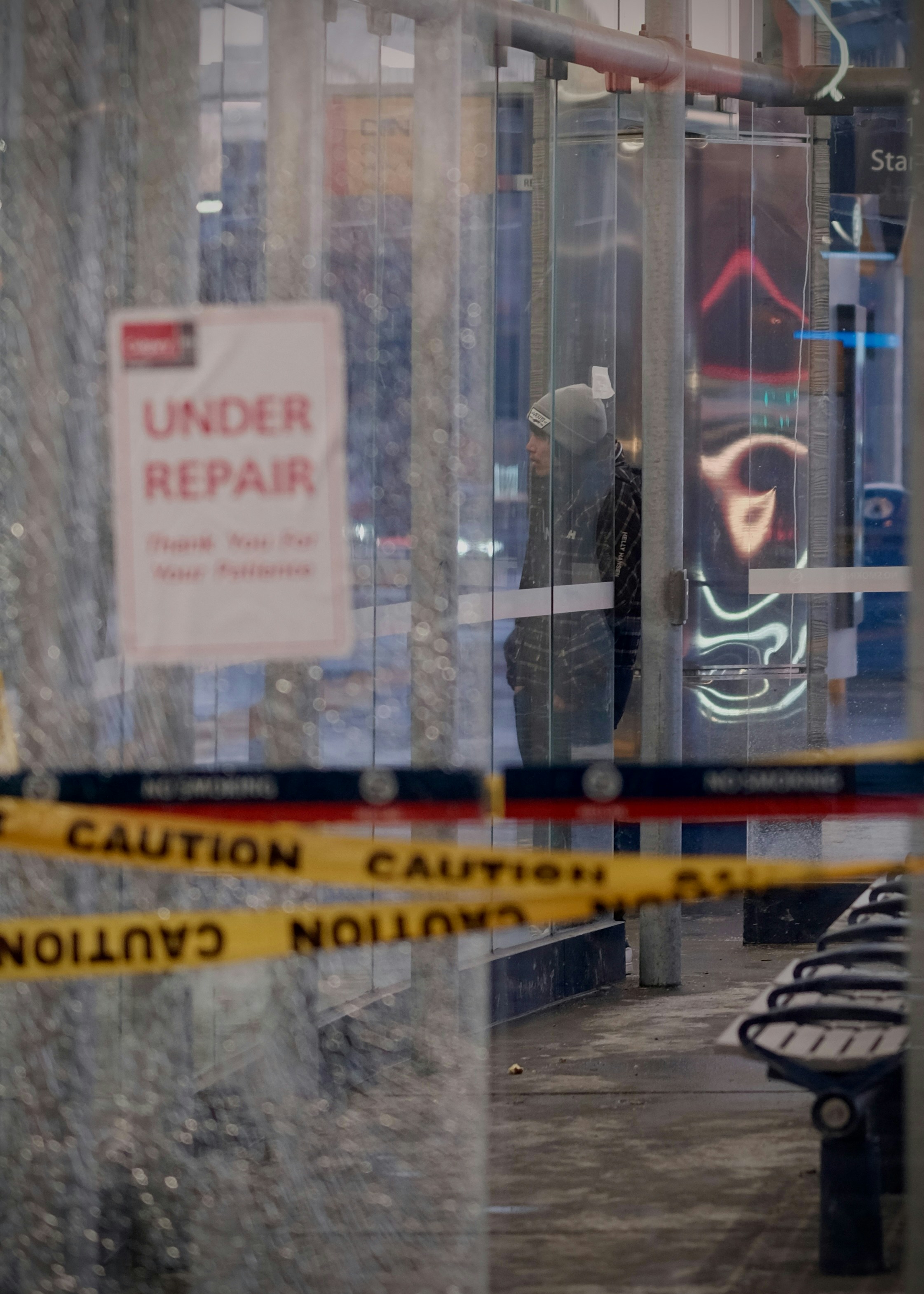 Masked by Glass: A Silent Watch at the Under Repair Entrance