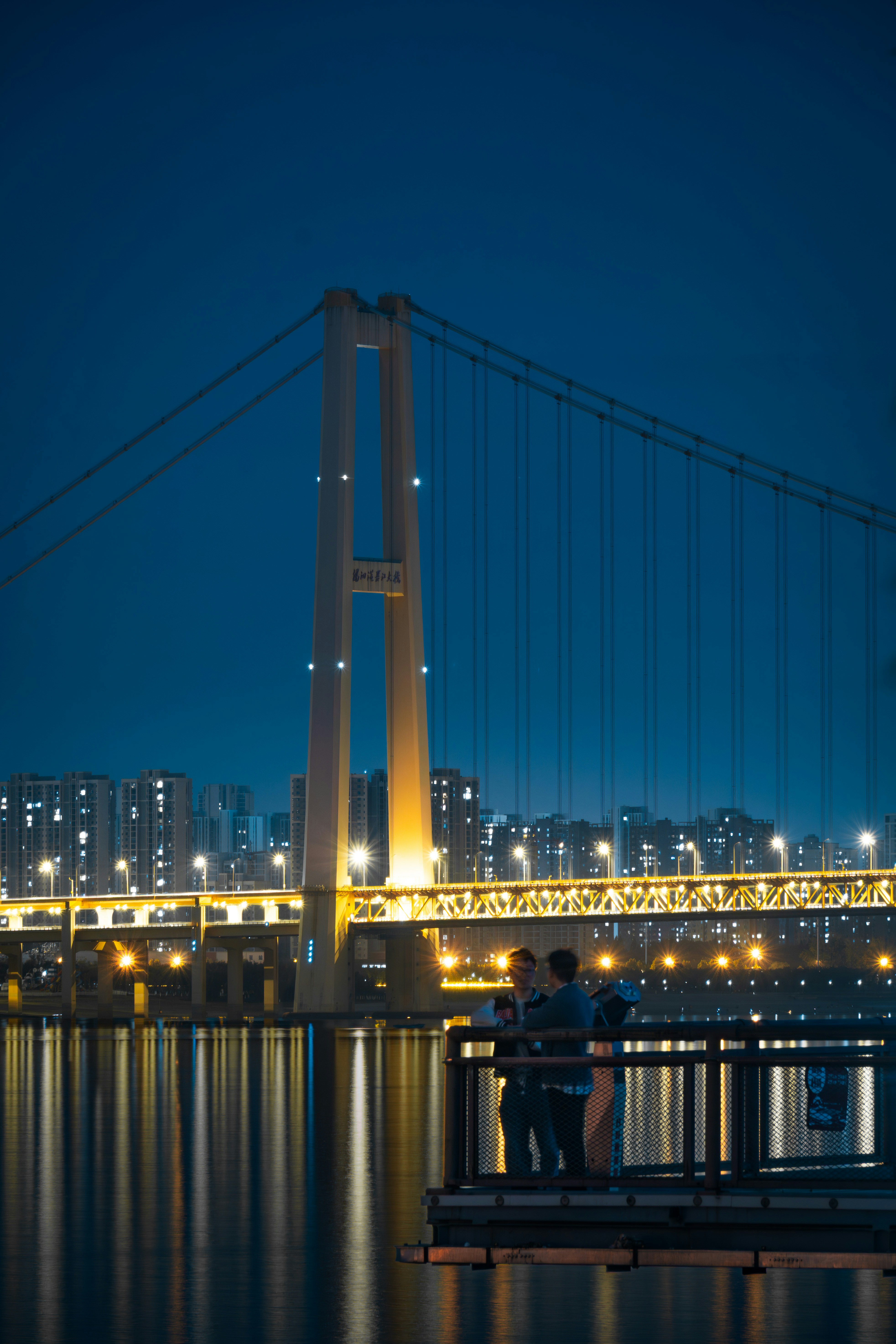 Night Ride Above the River: Neon Bridge and Lanterned Skyline