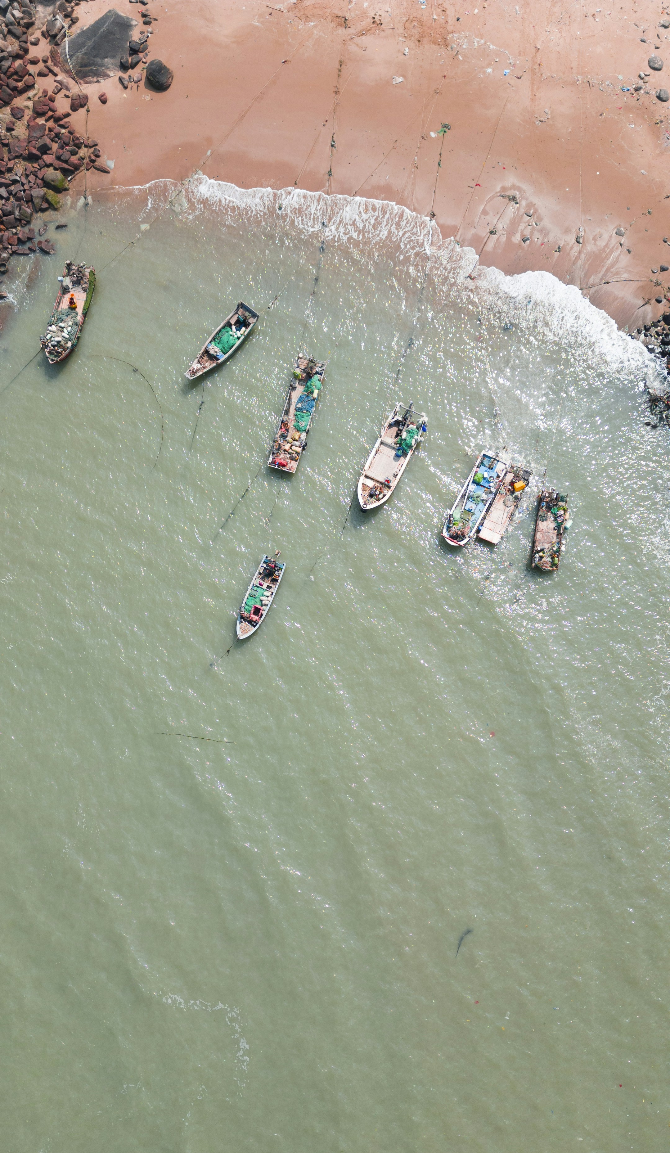 Boots and Boats: A Coral Strand Serenade from Above
