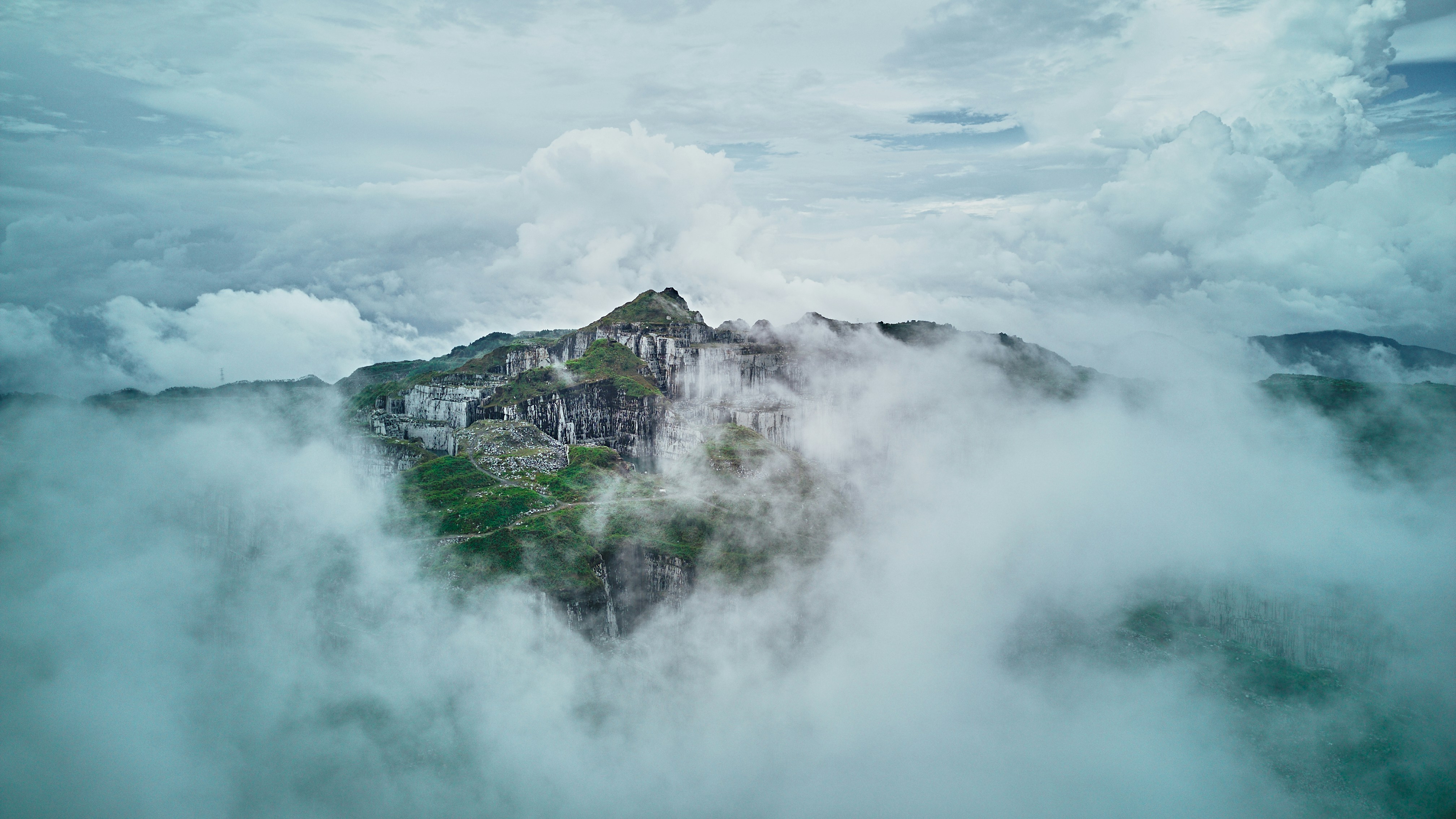 Mist-Crowned Ridge Emerging from the Clouds